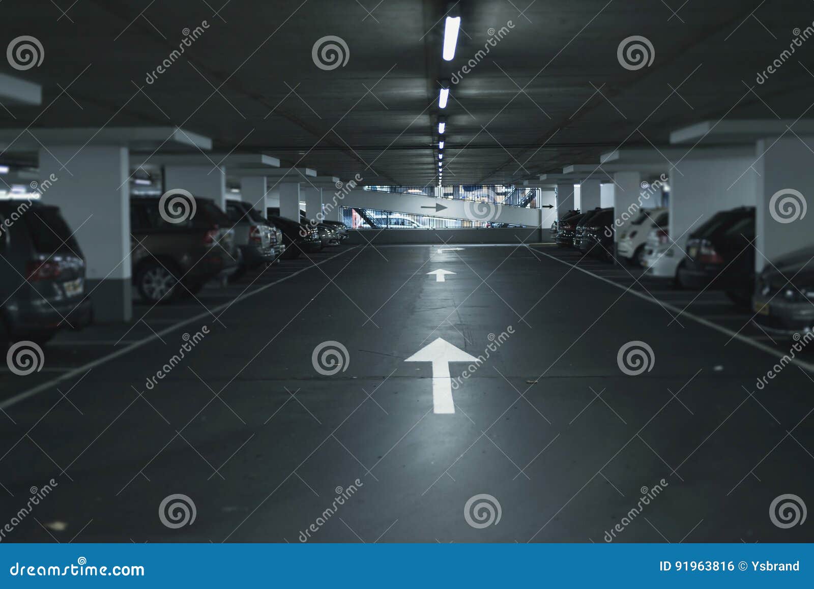 Arrow Sign on Driving Lane in Parking Garage. Stock Photo - Image of ...