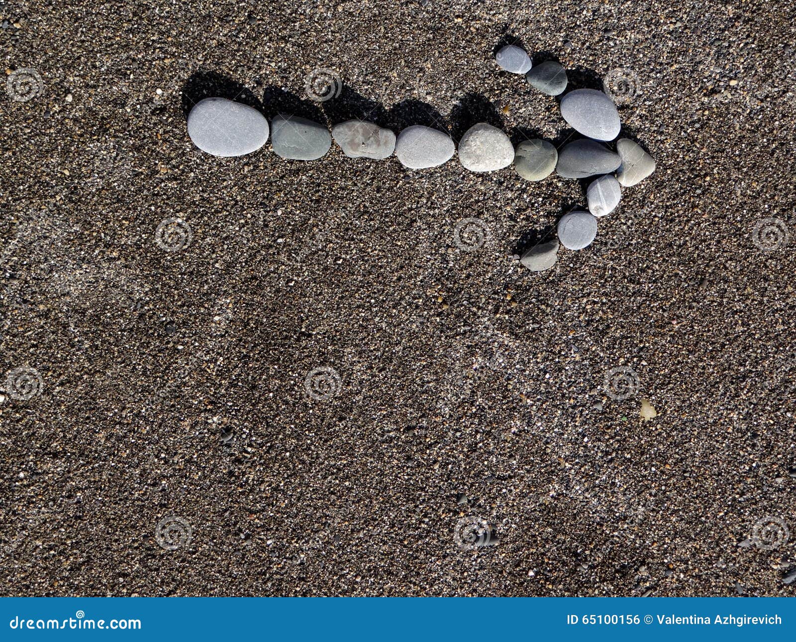 Arrow of Stones in the Sand Stock Photo - Image of relief, sand: 65100156
