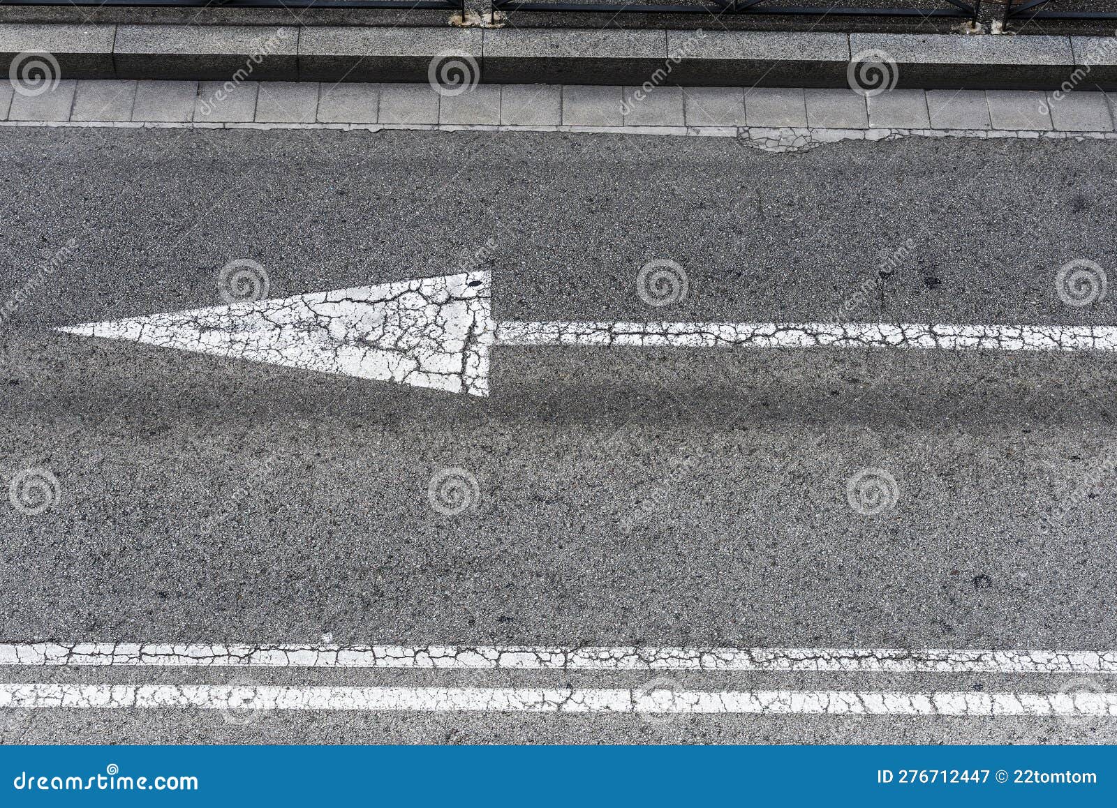 Arrow and Traffic Dividing Lines on Cracked Asphalt Stock Image - Image ...