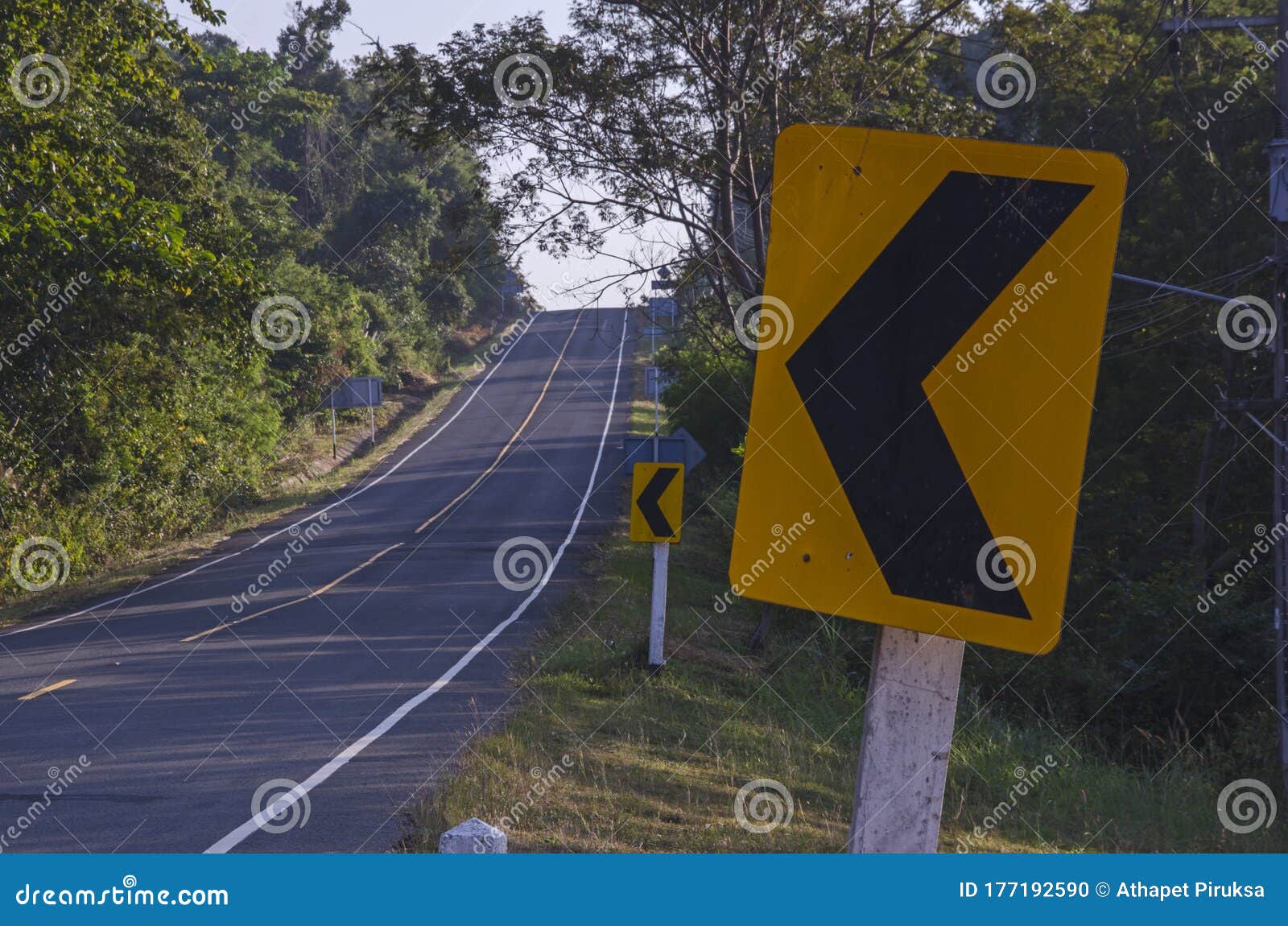 Arrow Traffic Sign beside the Road on the Hill Stock Photo - Image of ...