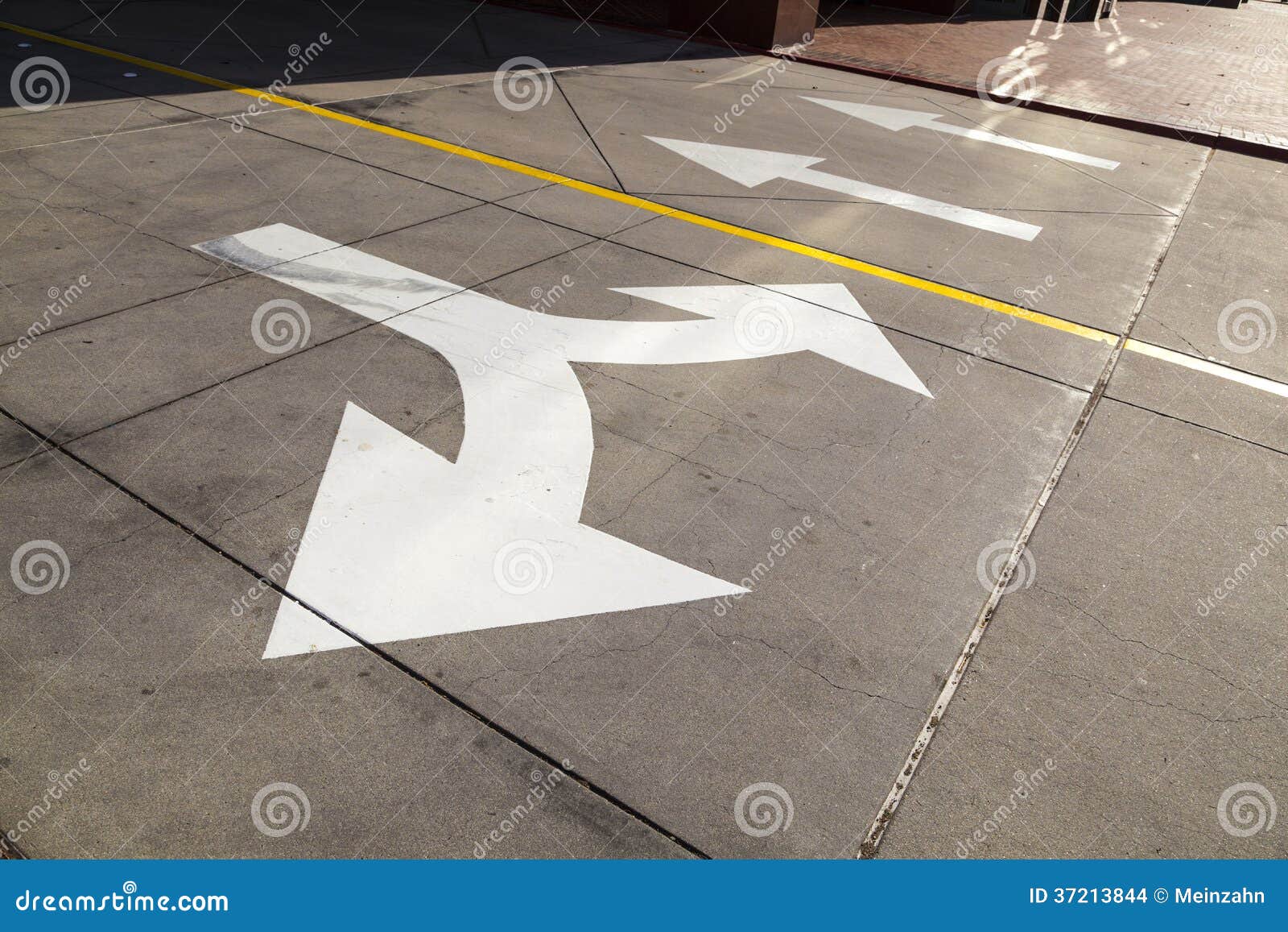 Arrows on the Asphalt To Indicate the Direction of Driving Stock Photo ...