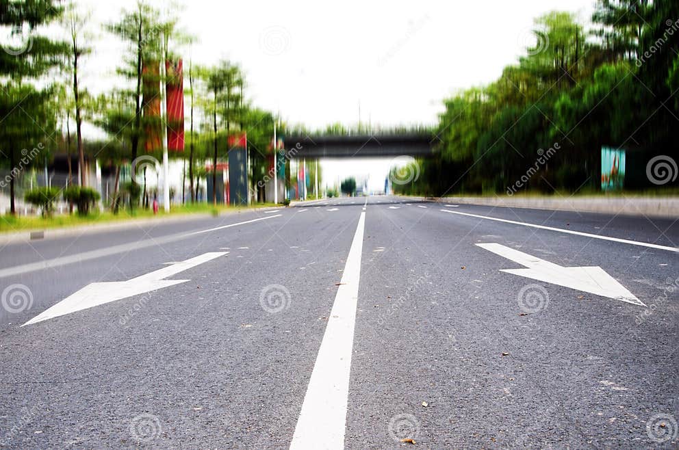 Arrows on the Asphalt To Indicate the Direction of Driving Stock Photo ...