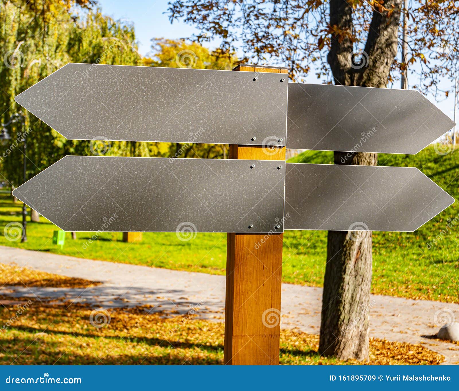 Arrows Indicating Direction in a Public Park Stock Image - Image of ...
