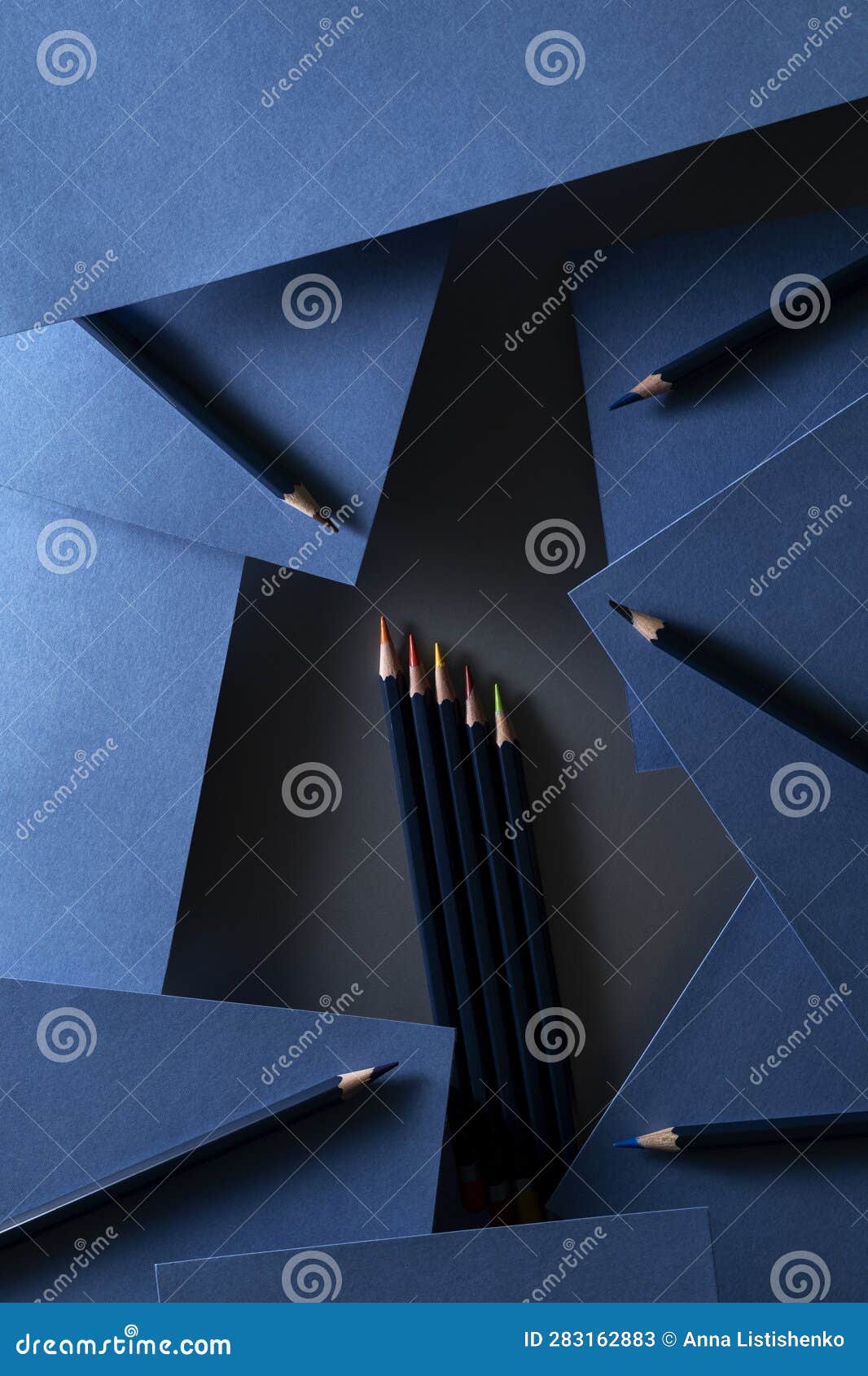 Art Composition with Colored Pencils and Sheets of Indigo Paper Lying ...