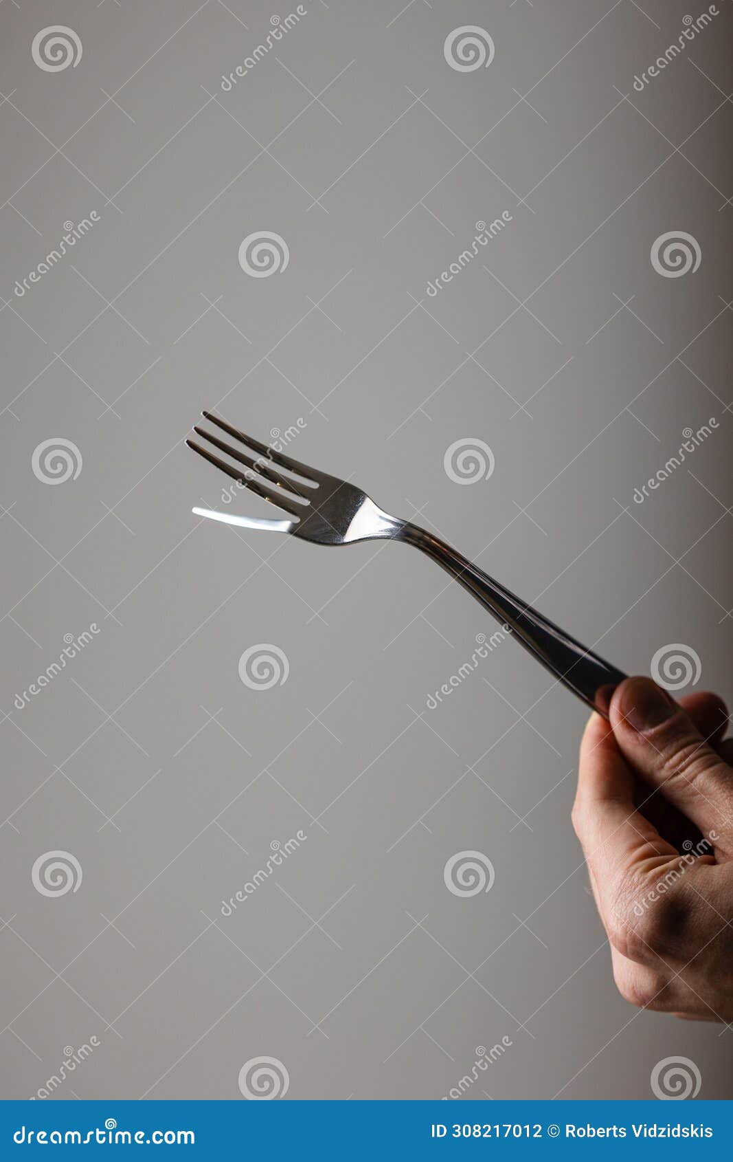 Art of Fork Bending, How To Bend Forks with Your Mind Stock Photo ...