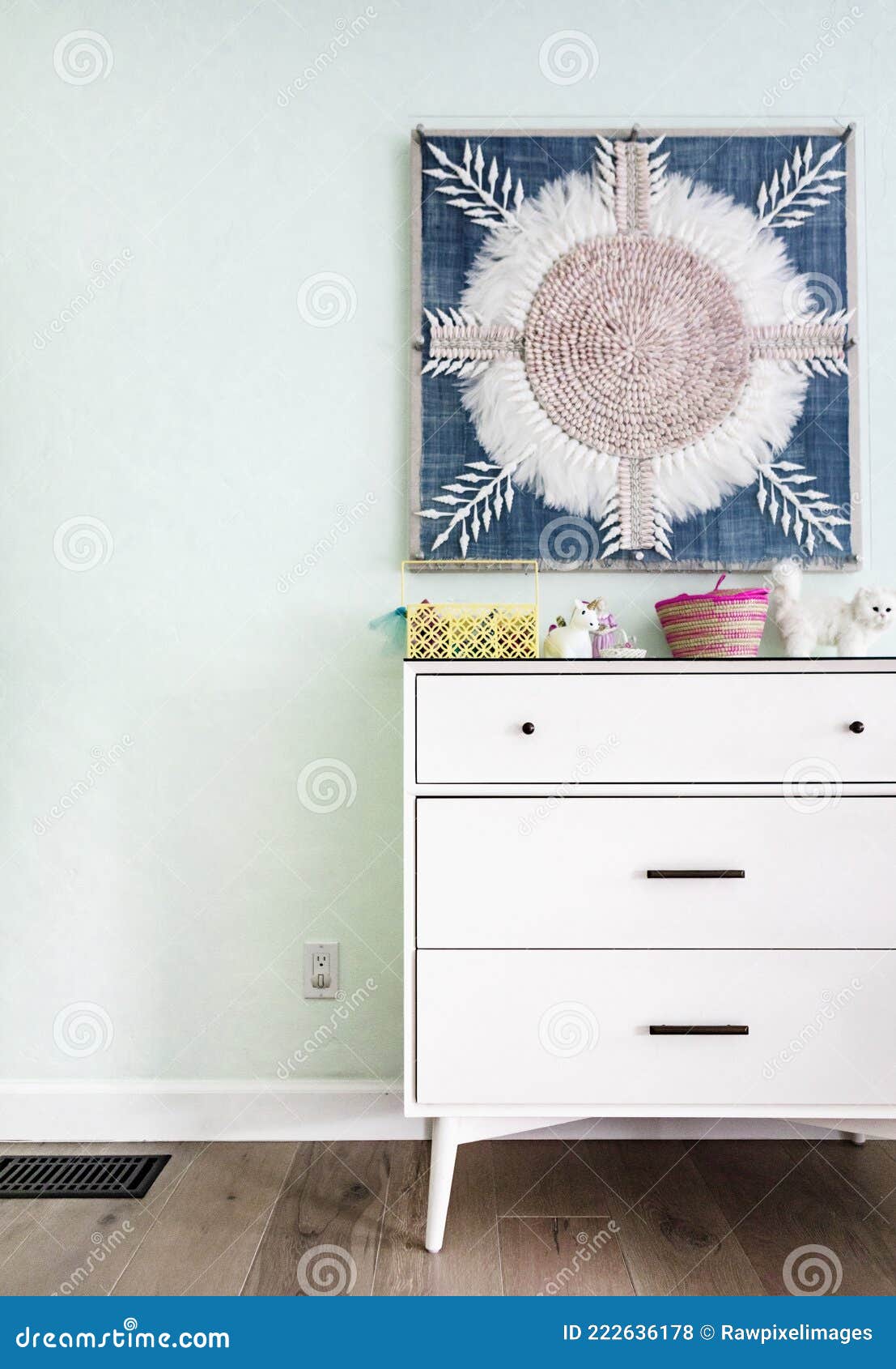 Art Hanging on a Wall Above a Drawer Stock Photo - Image of board ...