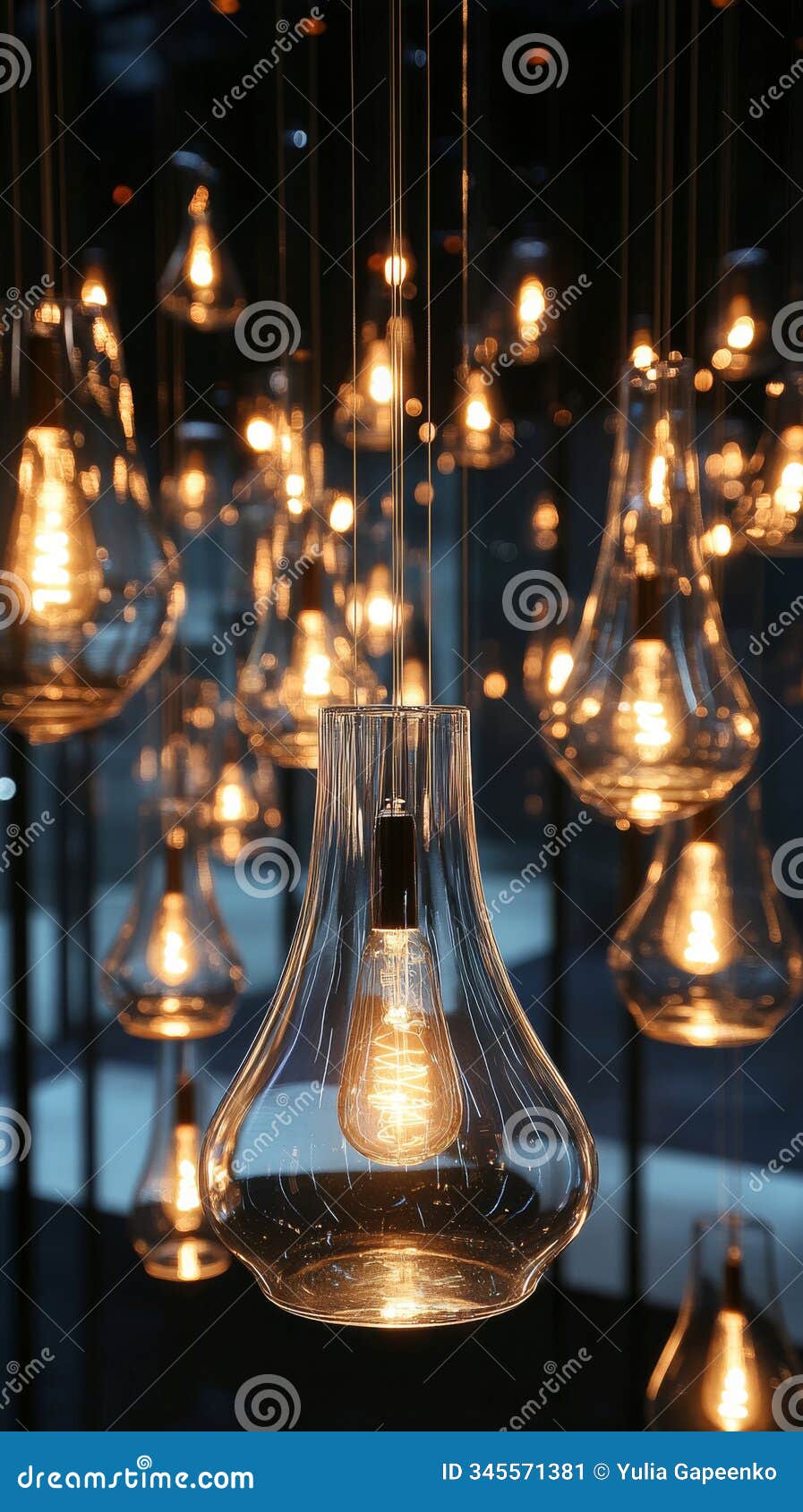 Art Installation Featuring Multiple Hanging Light Bulbs in a Darkened ...