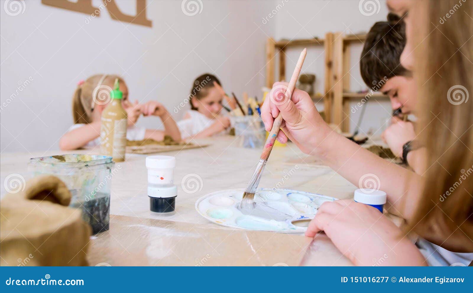 Art Lesson in Workshop with Children are Sculpting from Clay Stock ...