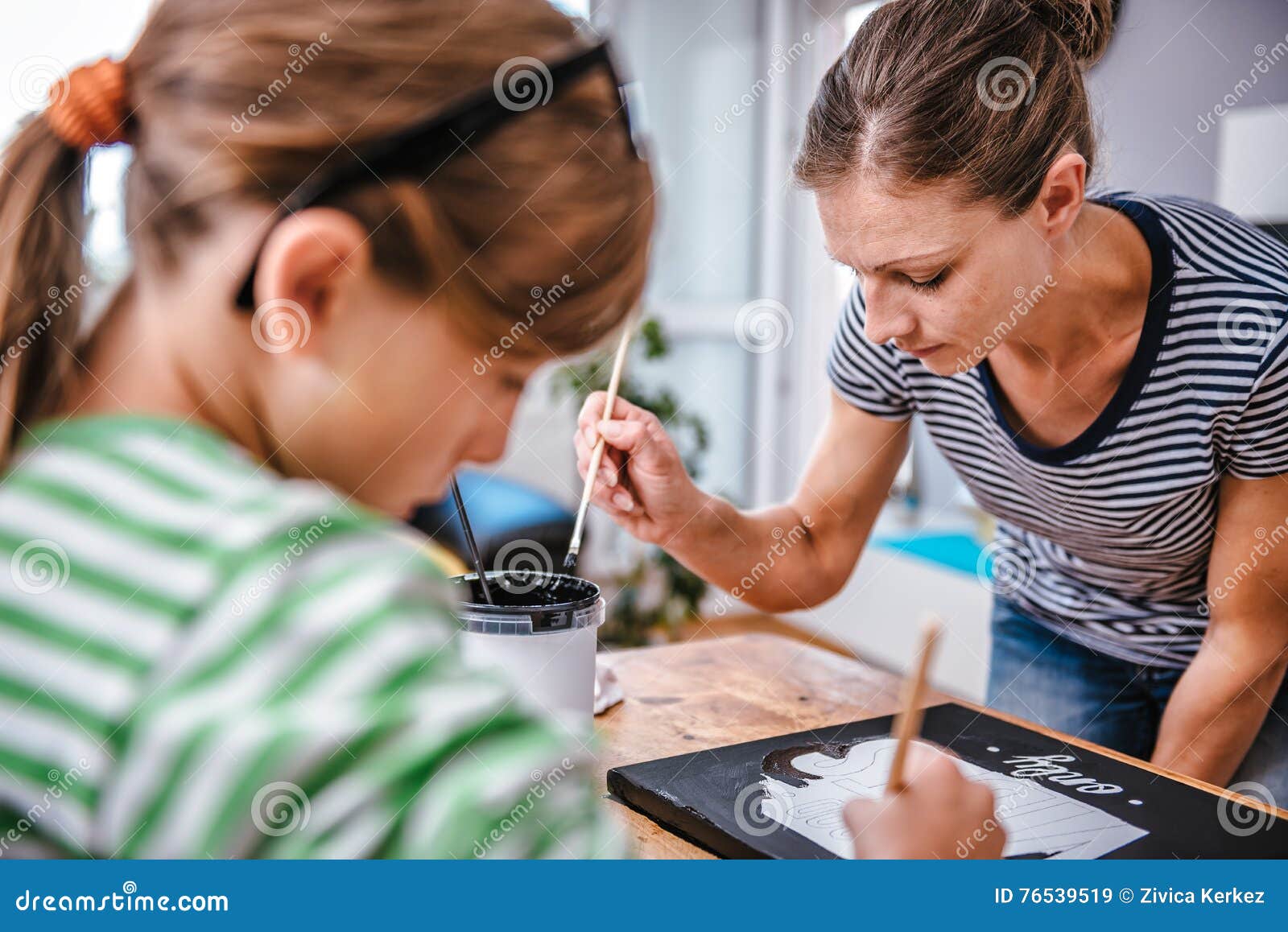 Art Teacher Helping a Student with Painting Stock Image - Image of ...
