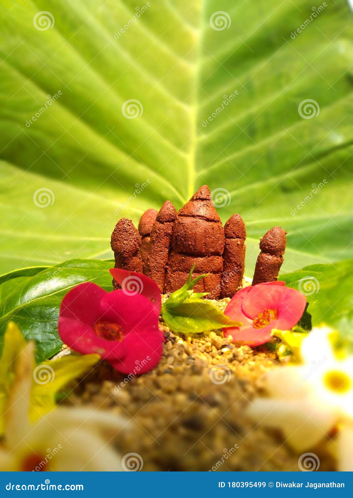 An Art Using Muddy Clay and Decorated with the Colourful Flowers and ...