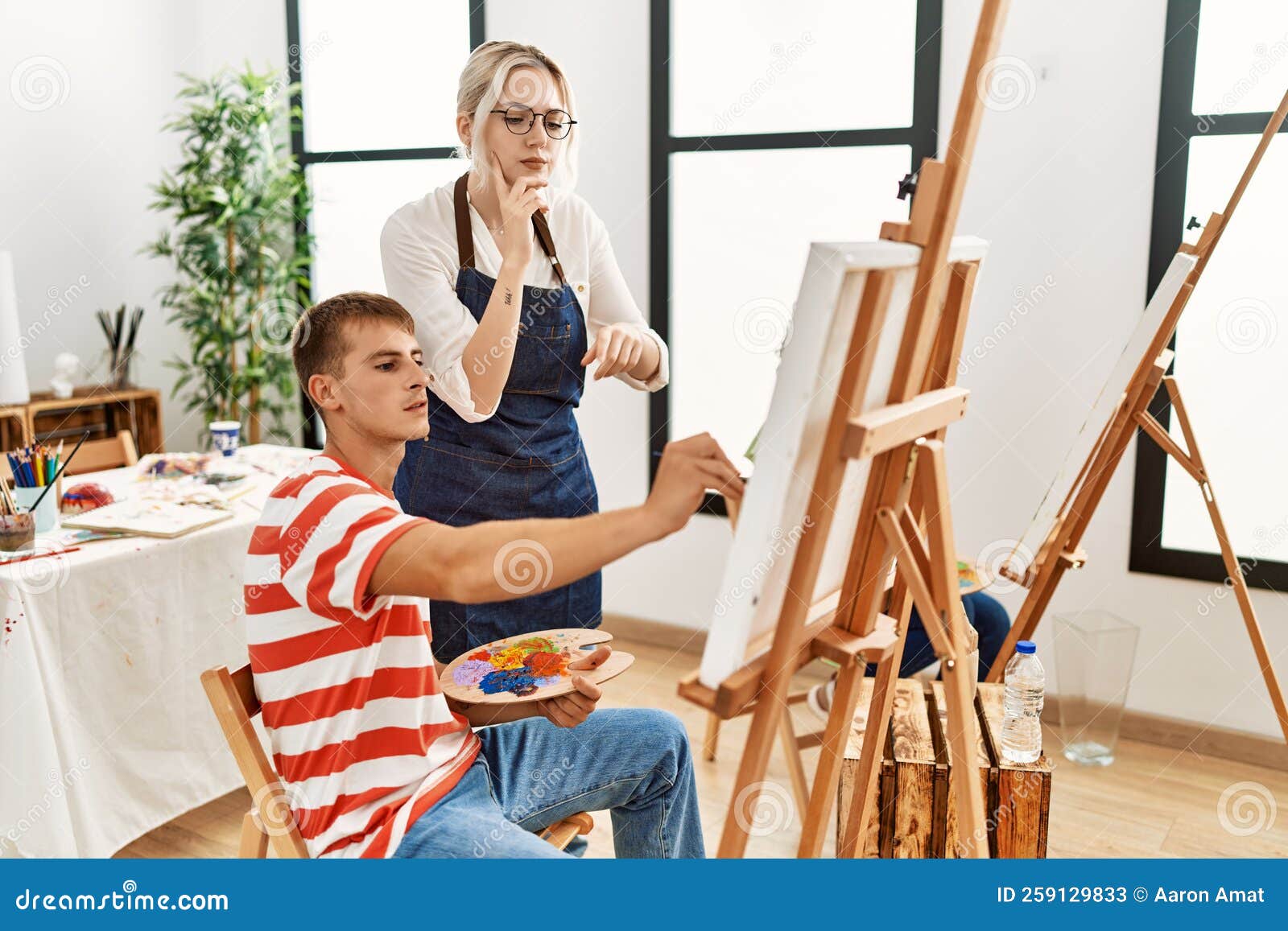 Art Woman Teacher with Serious Expression Looking Draw of Paint Student ...