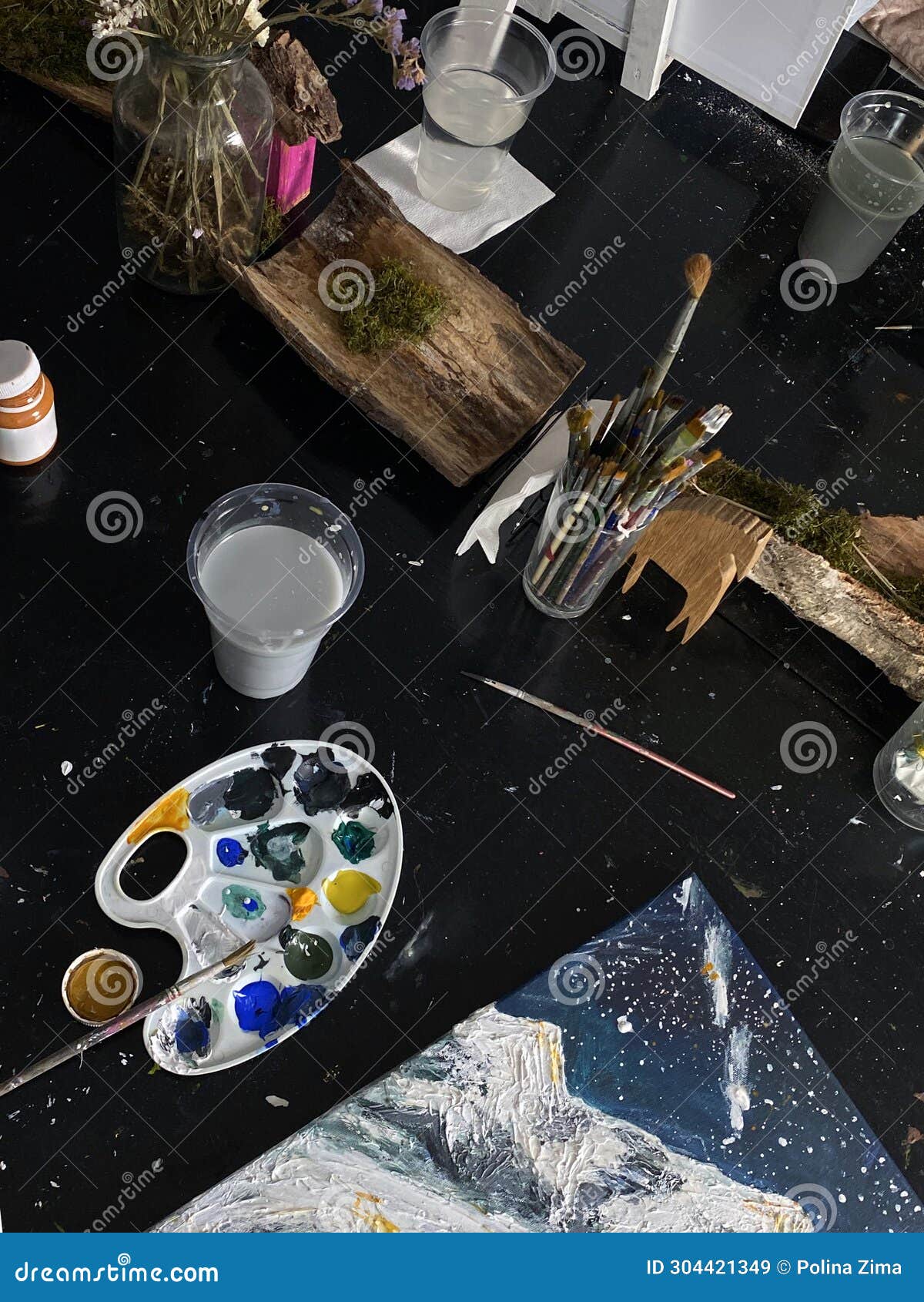 An Art Workshop with a Palette of Colorful Paints, Brushes in a Glass ...