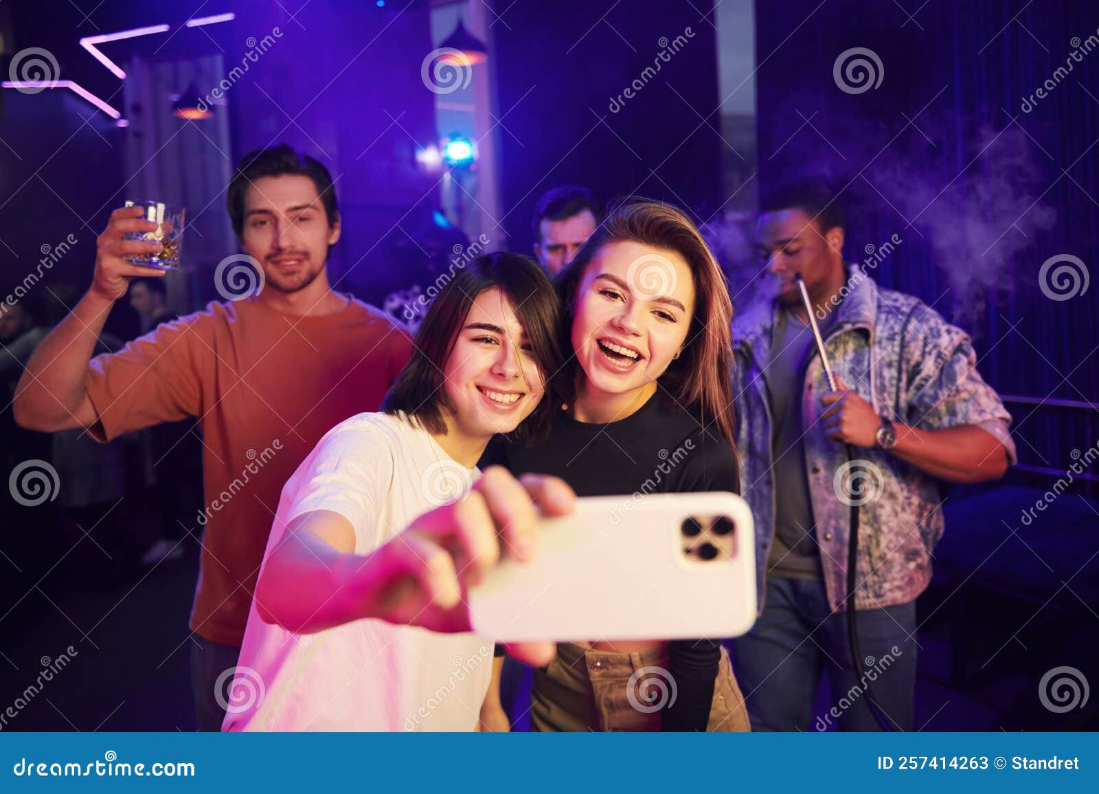 Artificial Blue Lighting. Group of Friends Having Fun in the Night Club ...