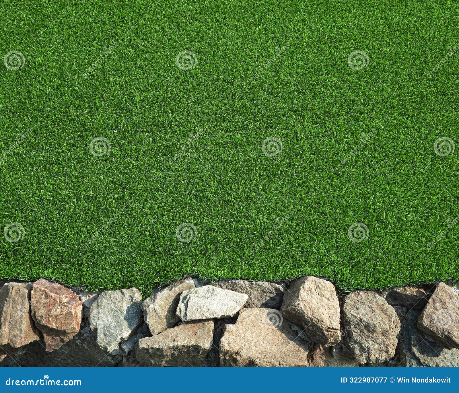 Artificial Green Grass Background with Decorative Rocks Stock Image ...