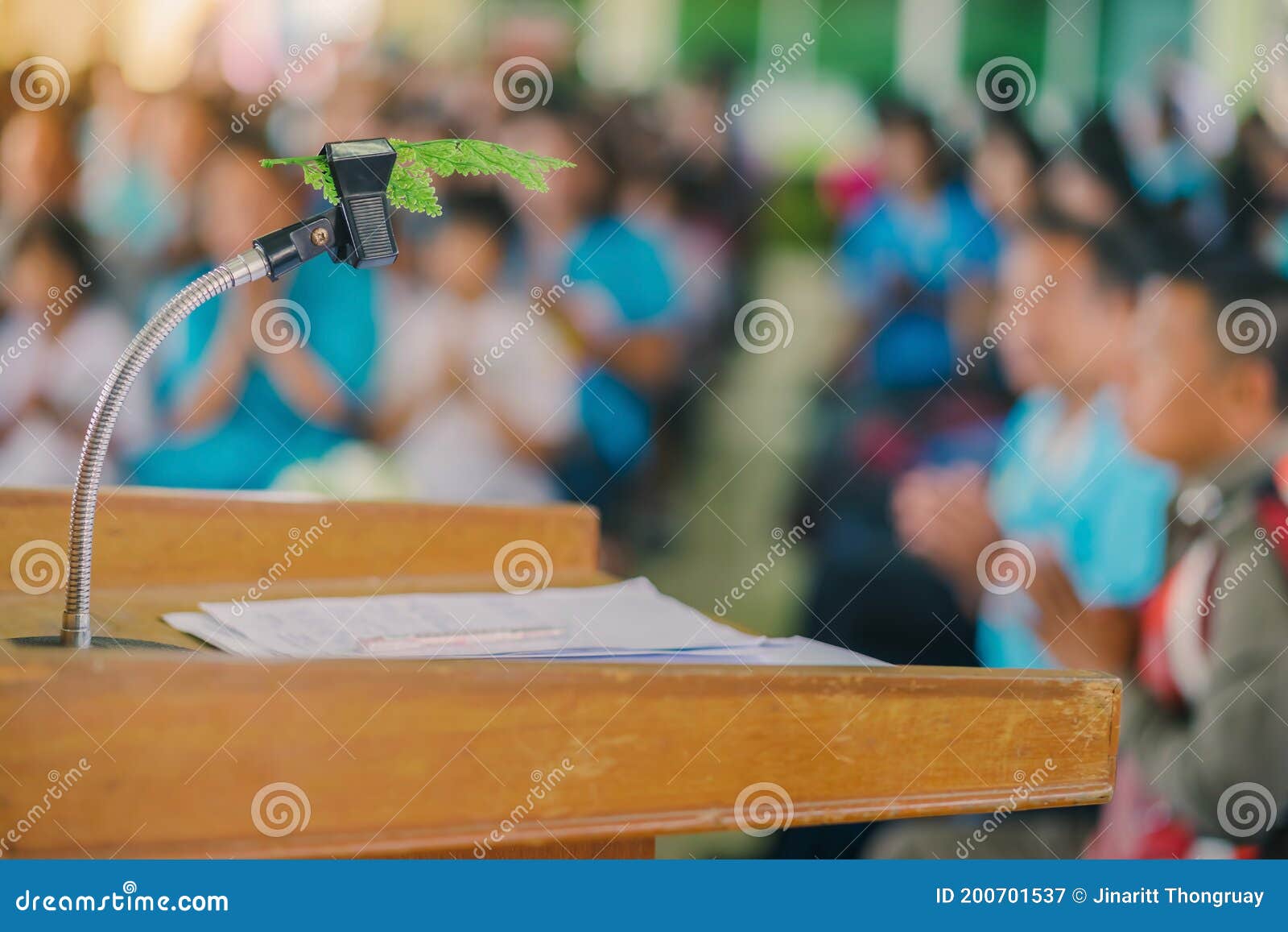 Artificial Leaf Inserted in the Desktop Microphone Stand on Podium in ...