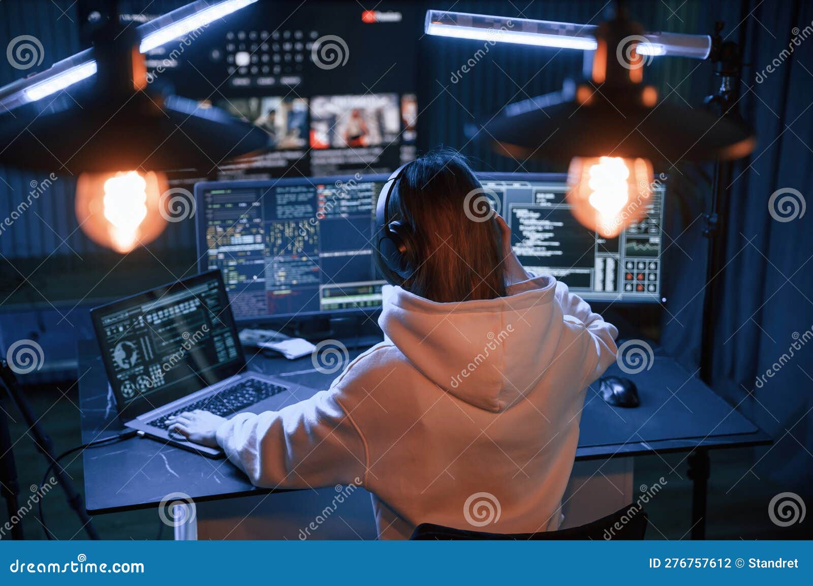 Artificial Lighting. Young Professional Female Hacker is Indoors by ...