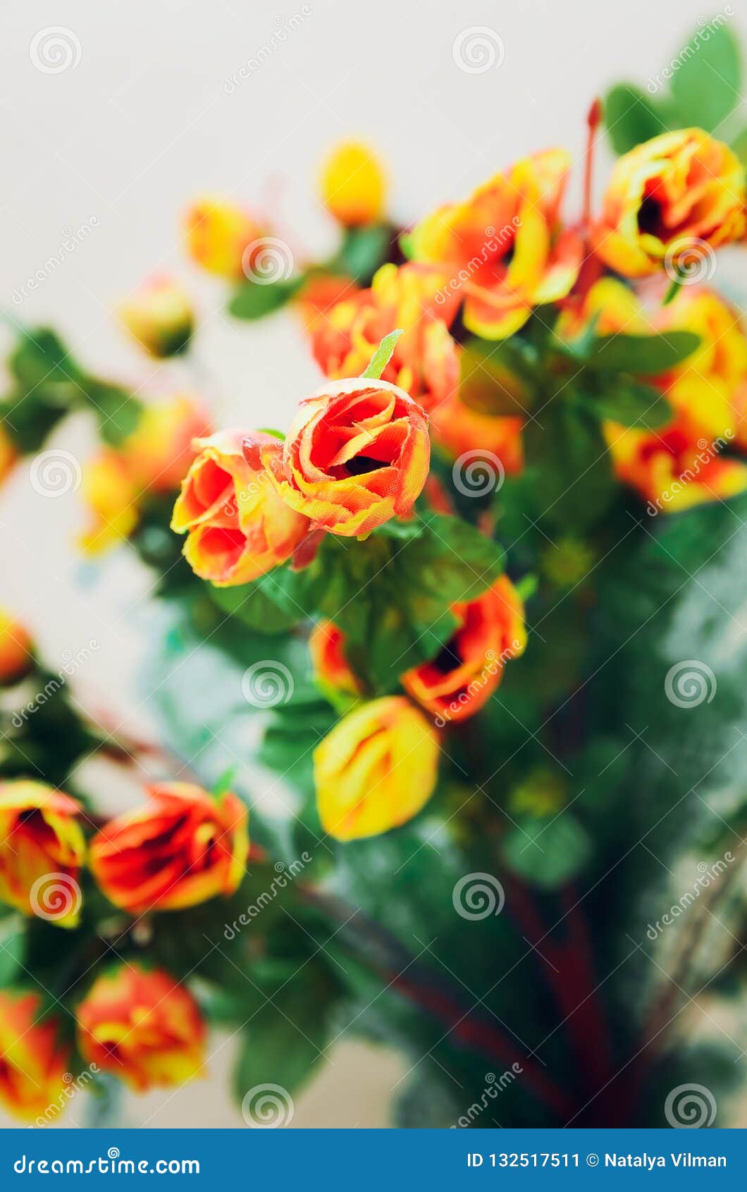 Artificial Orange Flowers in Bright Light Bulb. Artificial Roses ...