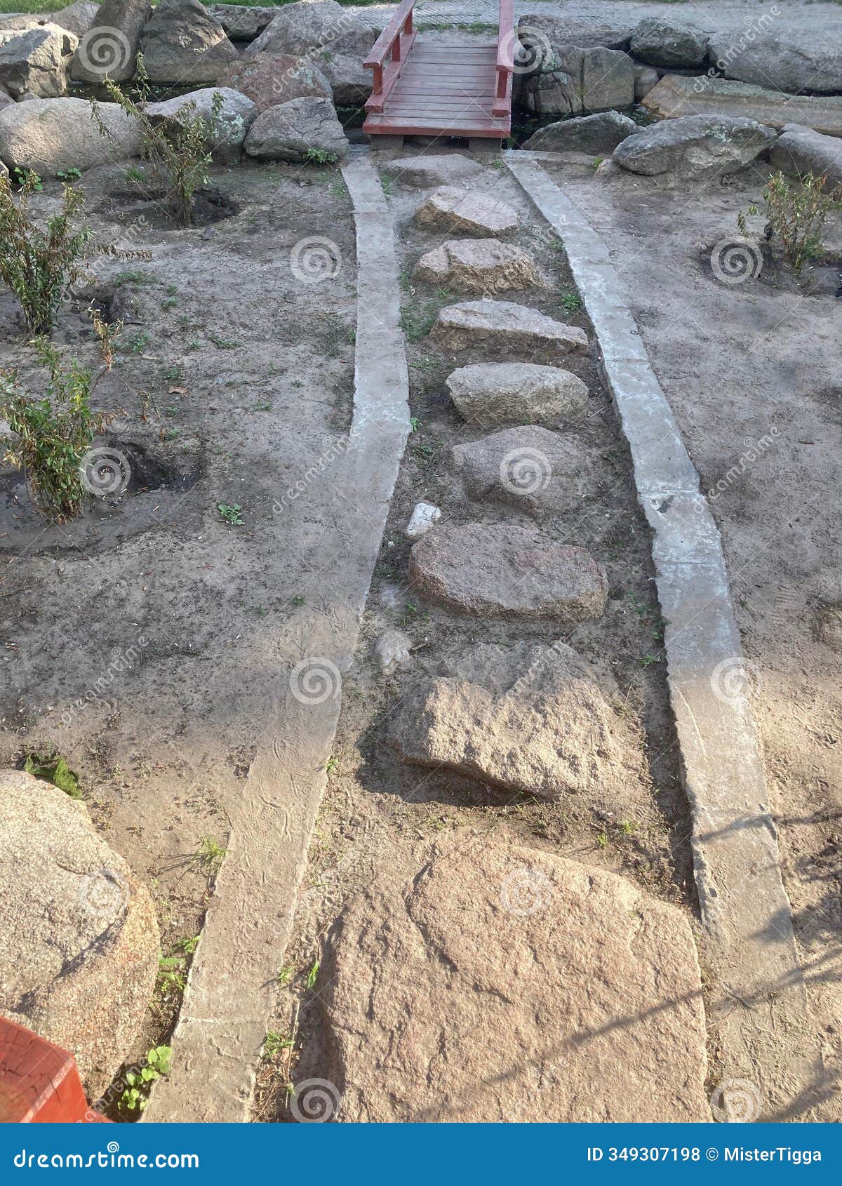 An Artificial Pathway with Irregular Rock Borders, Set Amidst a Wet ...