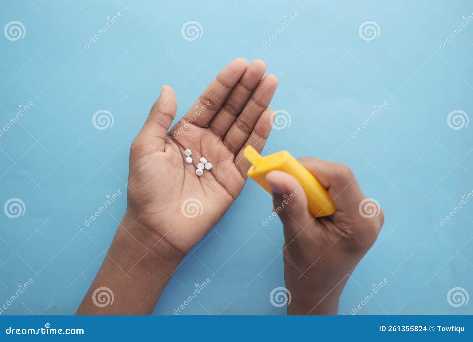 Artificial Sweetener Pouring from a Container on Hand on Table Stock ...