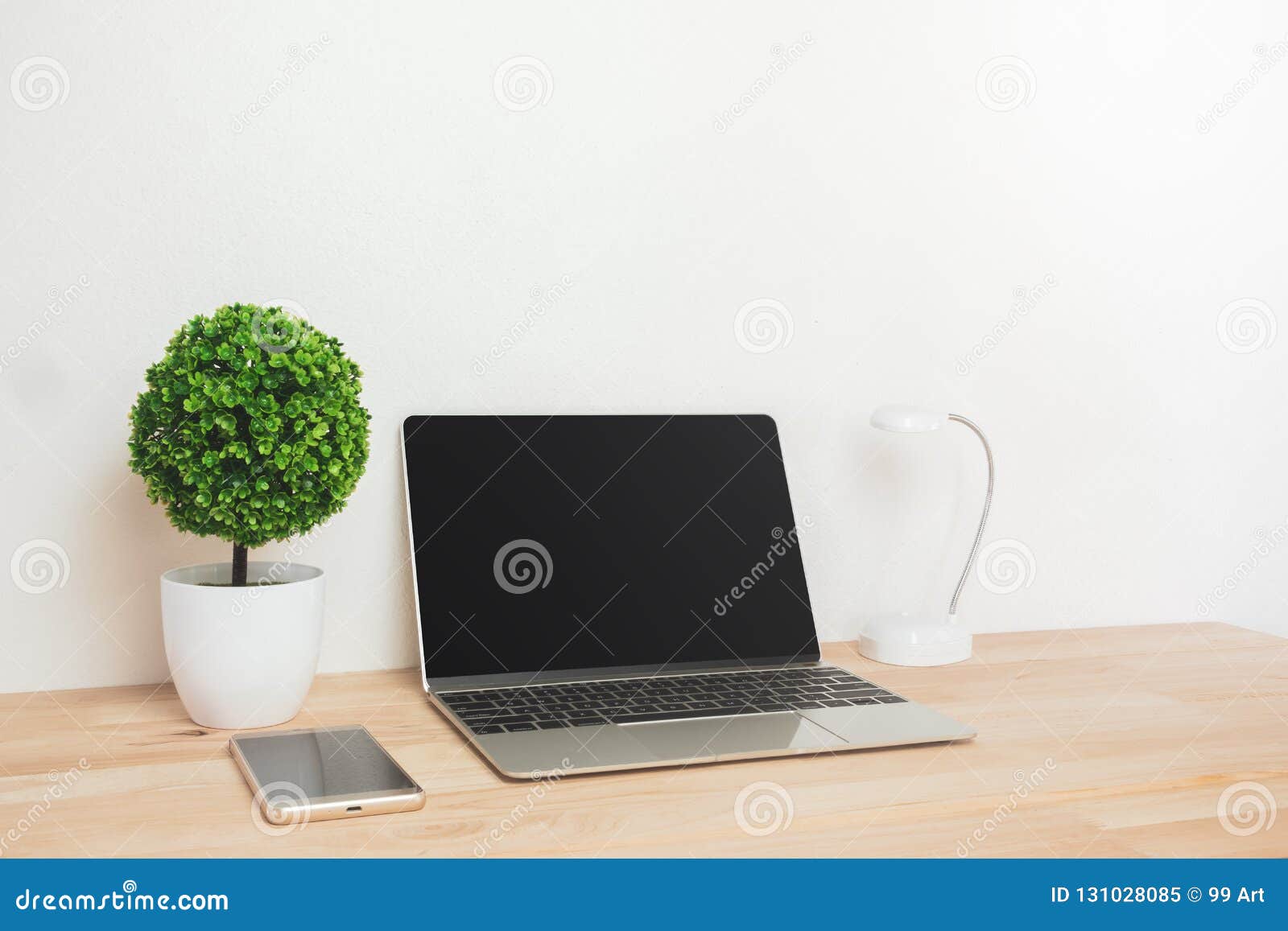 Artificial Tree with Notebook Laptop Mobile Phone and Pencil on Stock ...