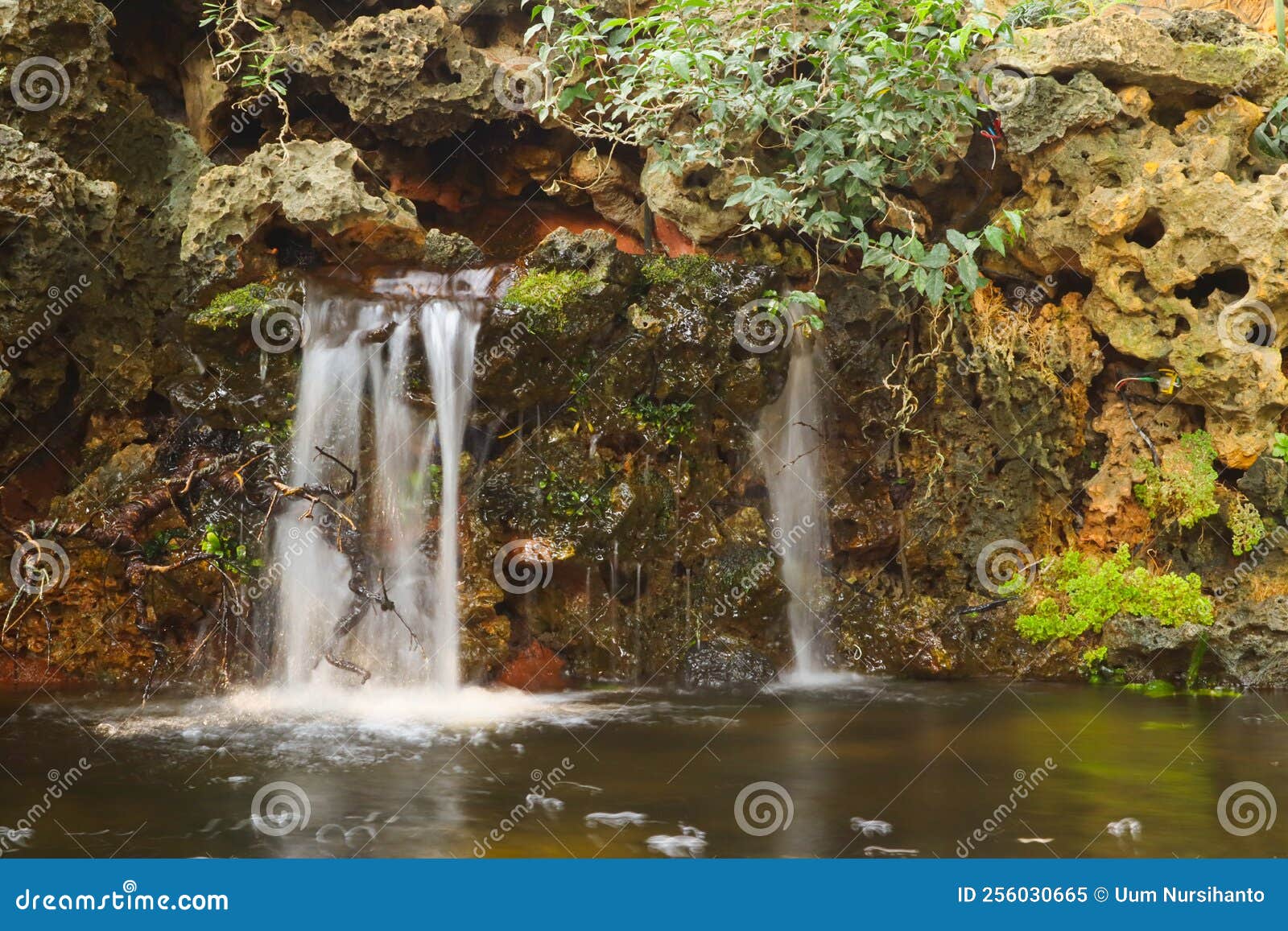 The Artificial Waterfall in the Corner of the Yard Serves To Keep the ...