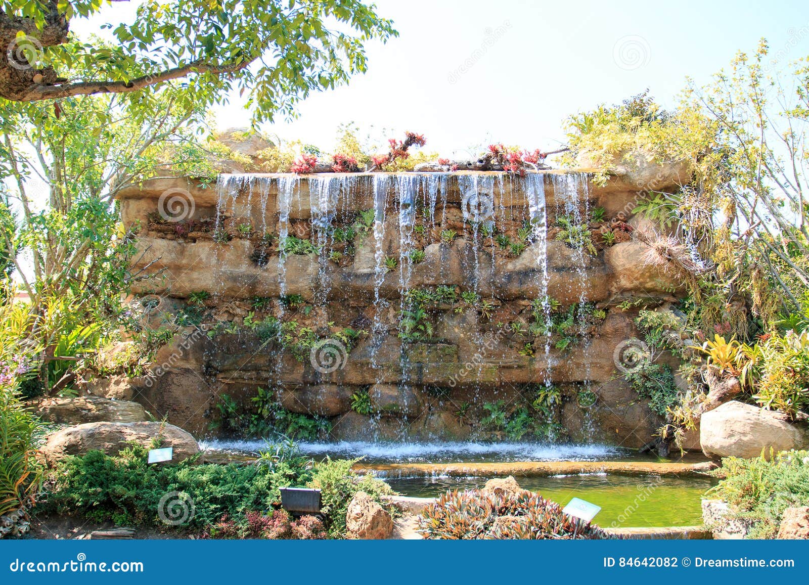 Artificial waterfall stock photo. Image of leaves, peaceful - 84642082