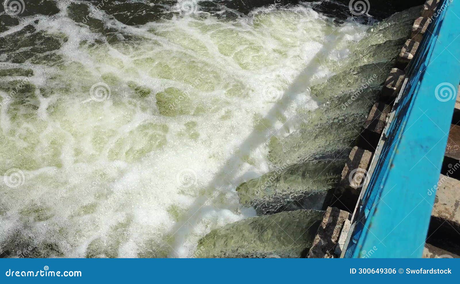 An Artificial Waterfall Made of Stones and a Dam. Water from the River ...