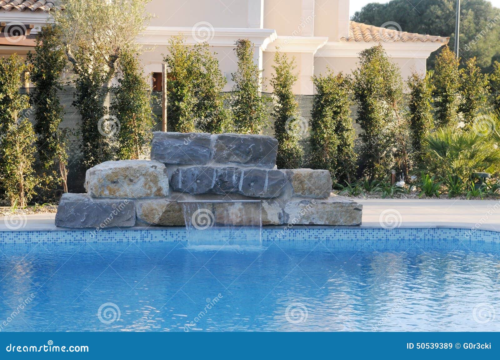 Artificial Waterfall Over Blue Pool - Home - Luxury Stock Image - Image ...