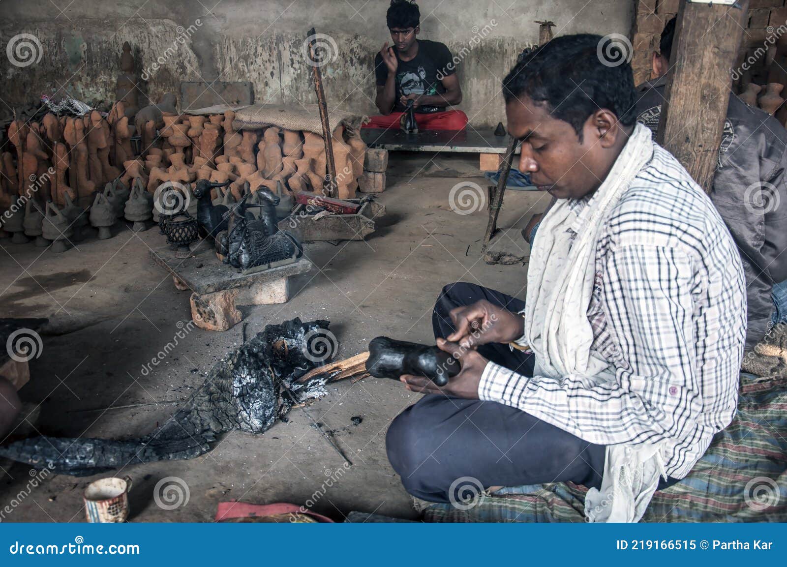 An Artisan Busy with Making Dokra Objects in a Home Workshop in ...