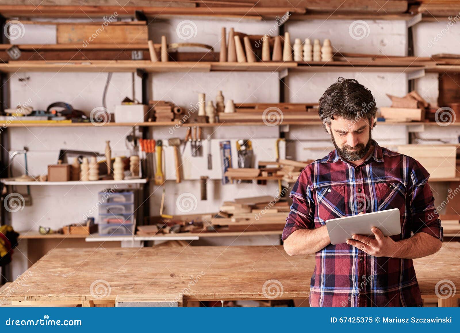 Artisan Carpenter in His Woodwork Studio Using Digital Tablet Stock ...