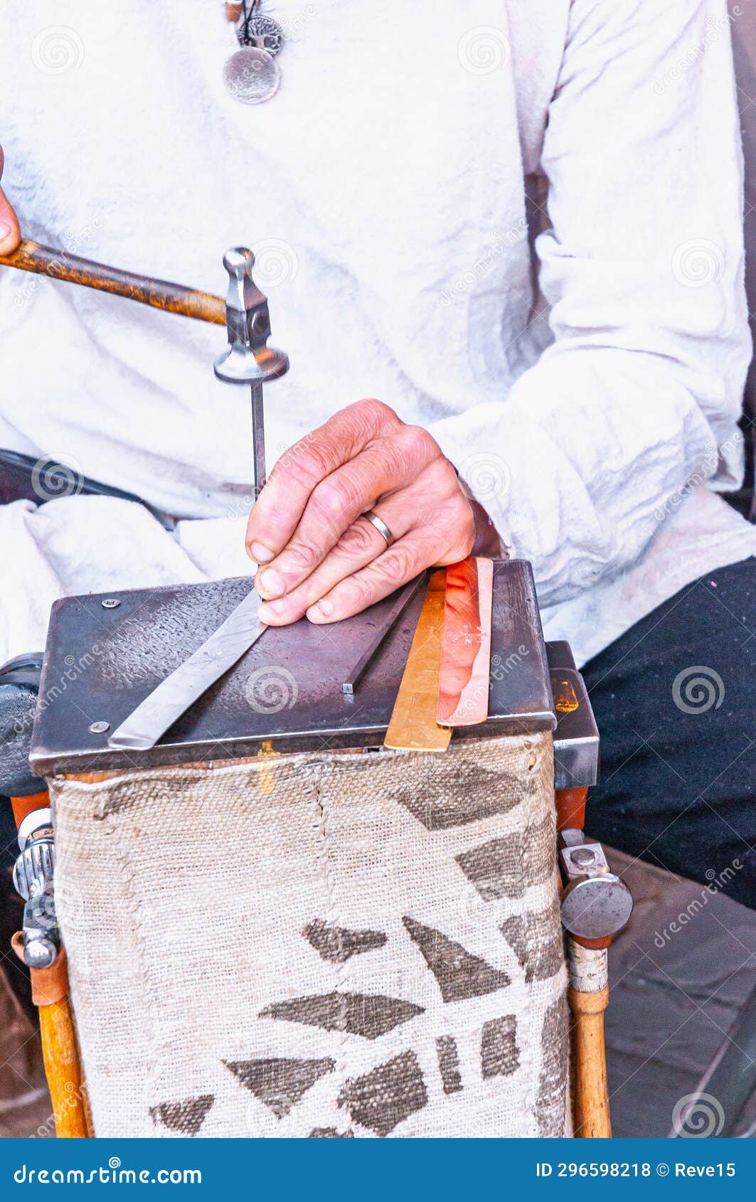 Artisan Scoring a Design on Metal Strip Stock Photo - Image of metal ...