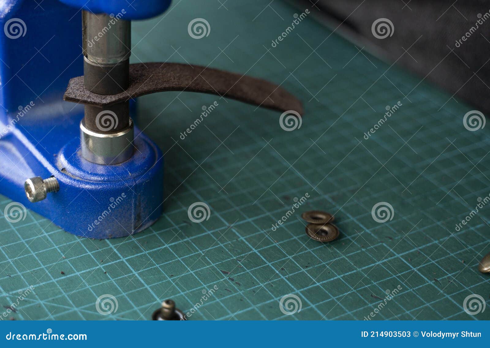 Artisan Using Hand Press for Setting Snaps in Leather for Makes a ...