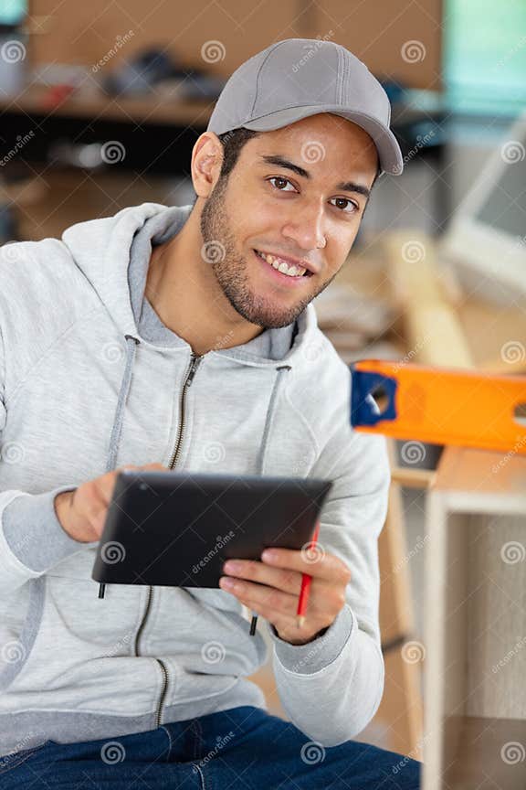 Artisan Using Tablet Computer in Construction Site Stock Image - Image ...
