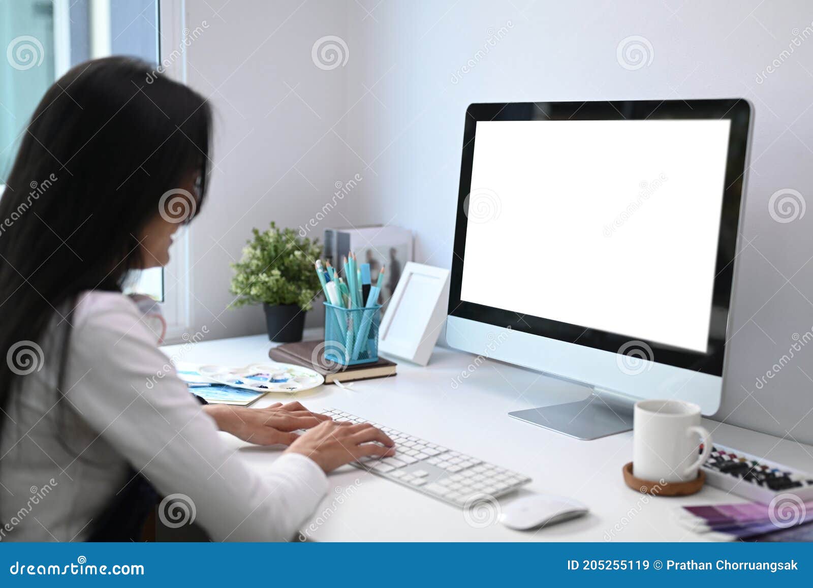 A Designer Working on Computer with White Screen at Creative Workplace ...
