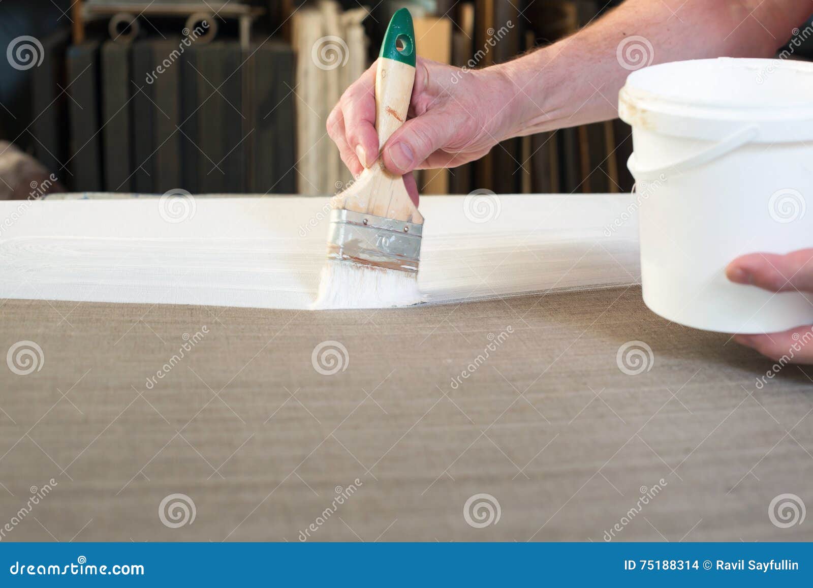 An artist priming canvas. stock photo. Image of artist - 75188314