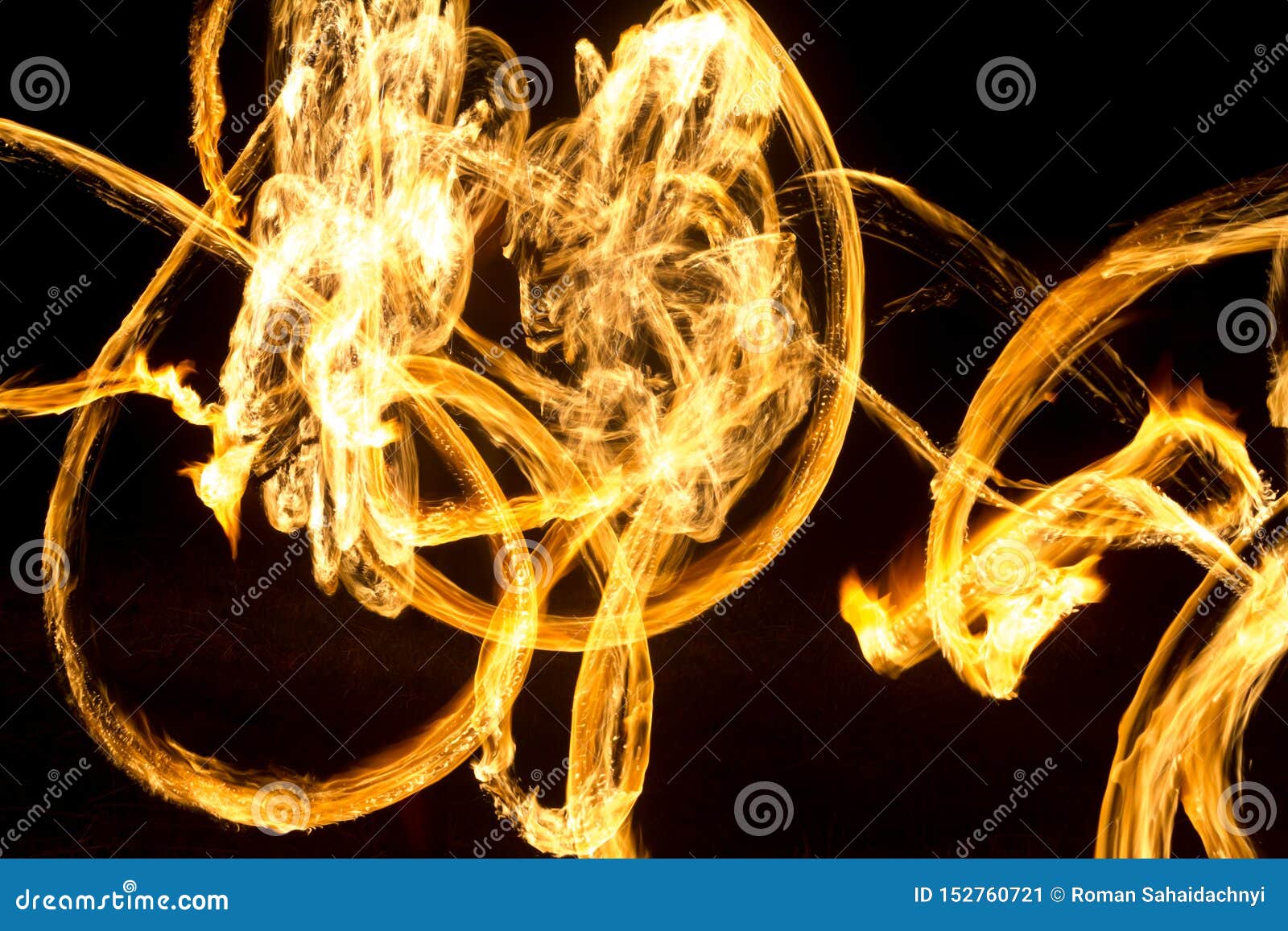 The Artist Shows a Fire Show at Night Spinning Torches, Circles of Fire ...
