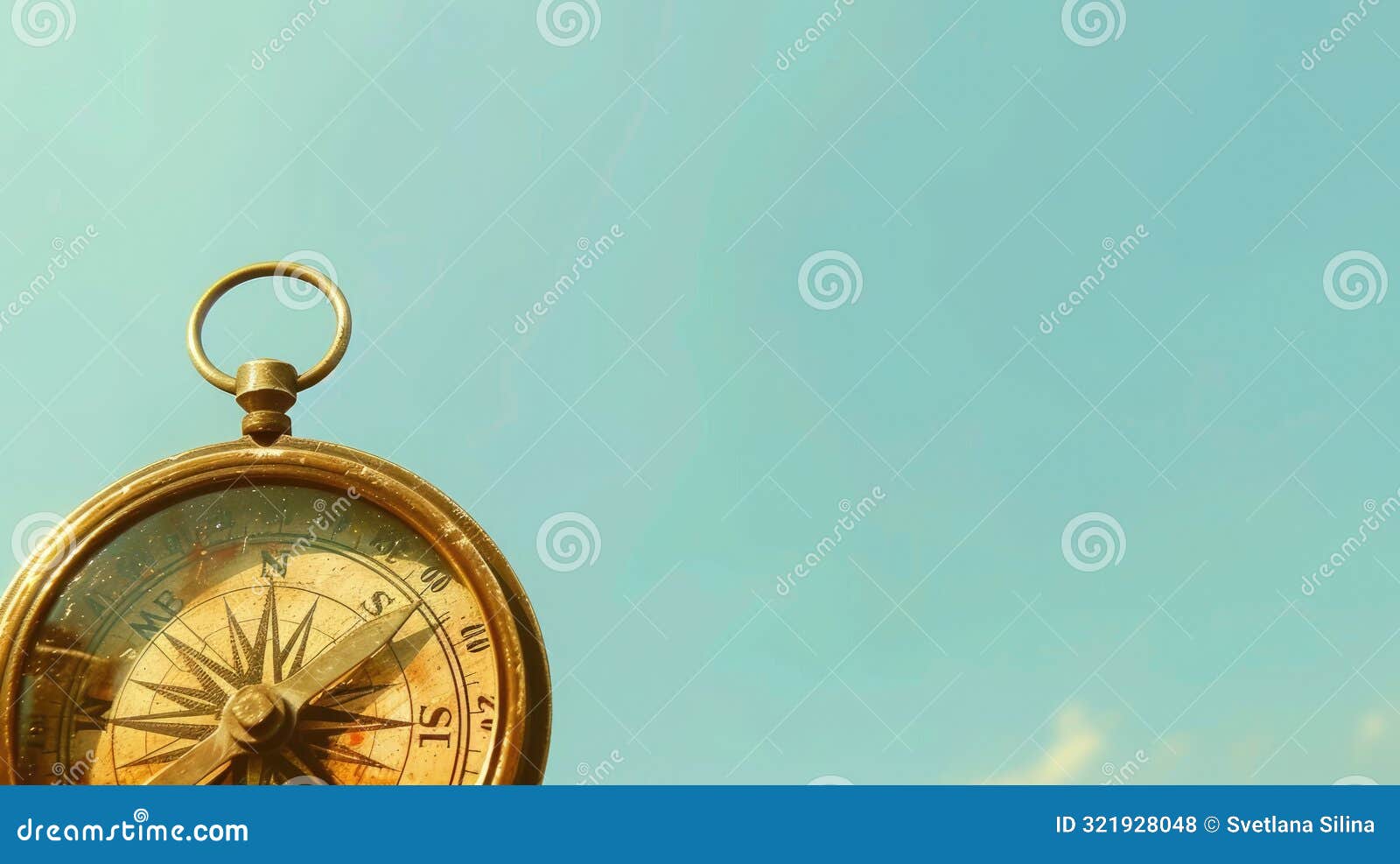 Artistic Old Compass on a Sky Blue Background with Generous Copyspace ...