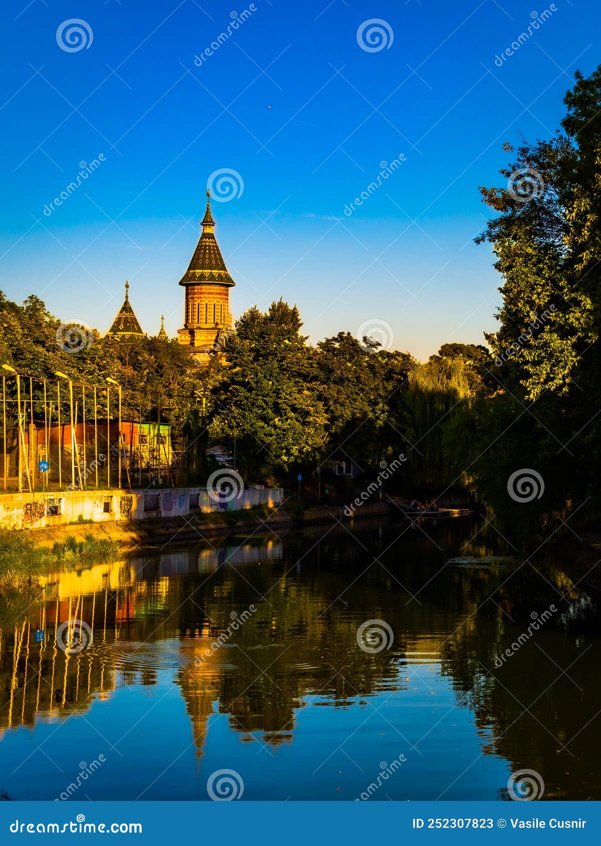 Artistic Photo of Timisoara Cathedral Reflecting in Bega River Stock ...