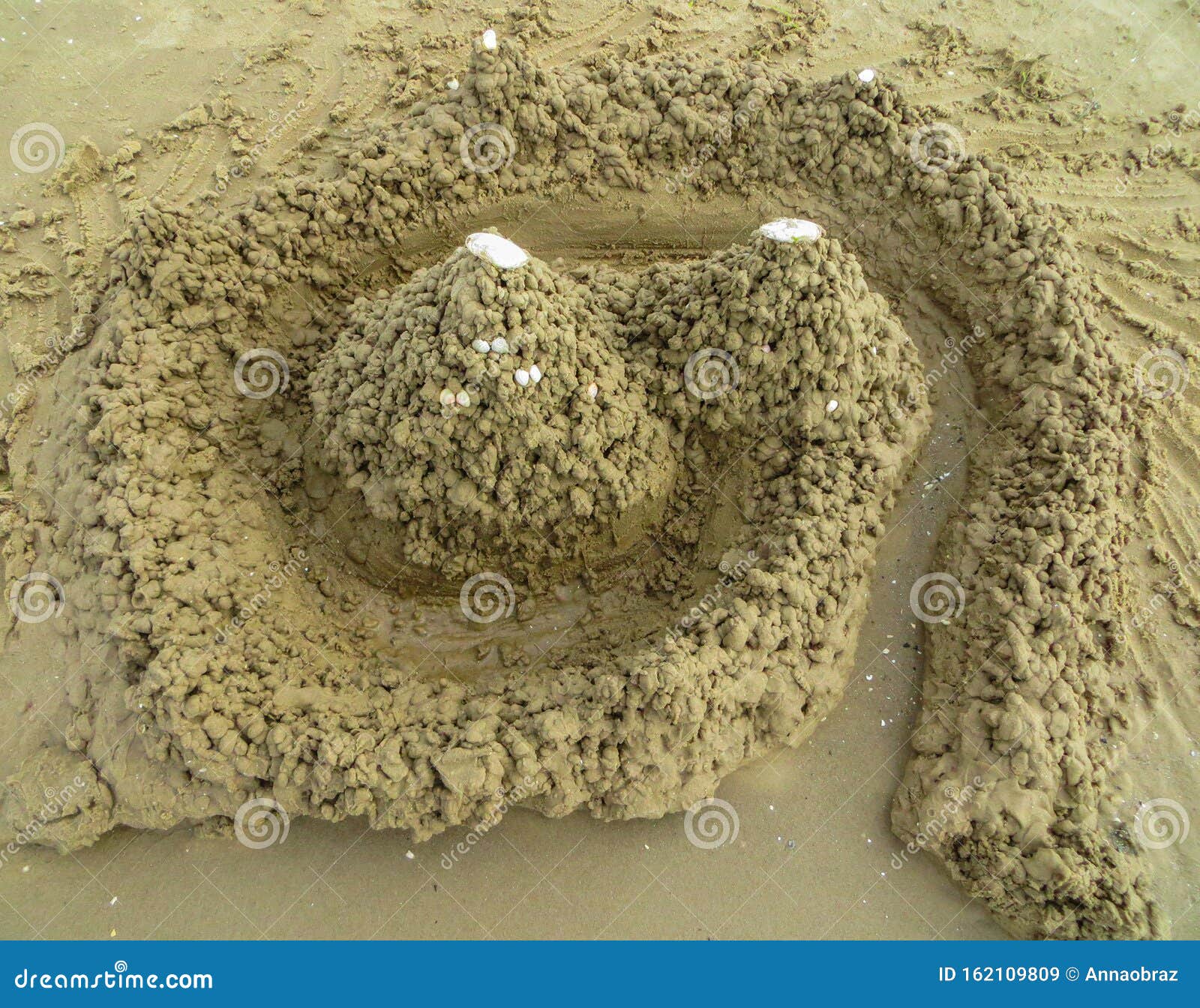 Artistic Sand Drawings on the Beach with Pebbles and Wooden Sticks ...