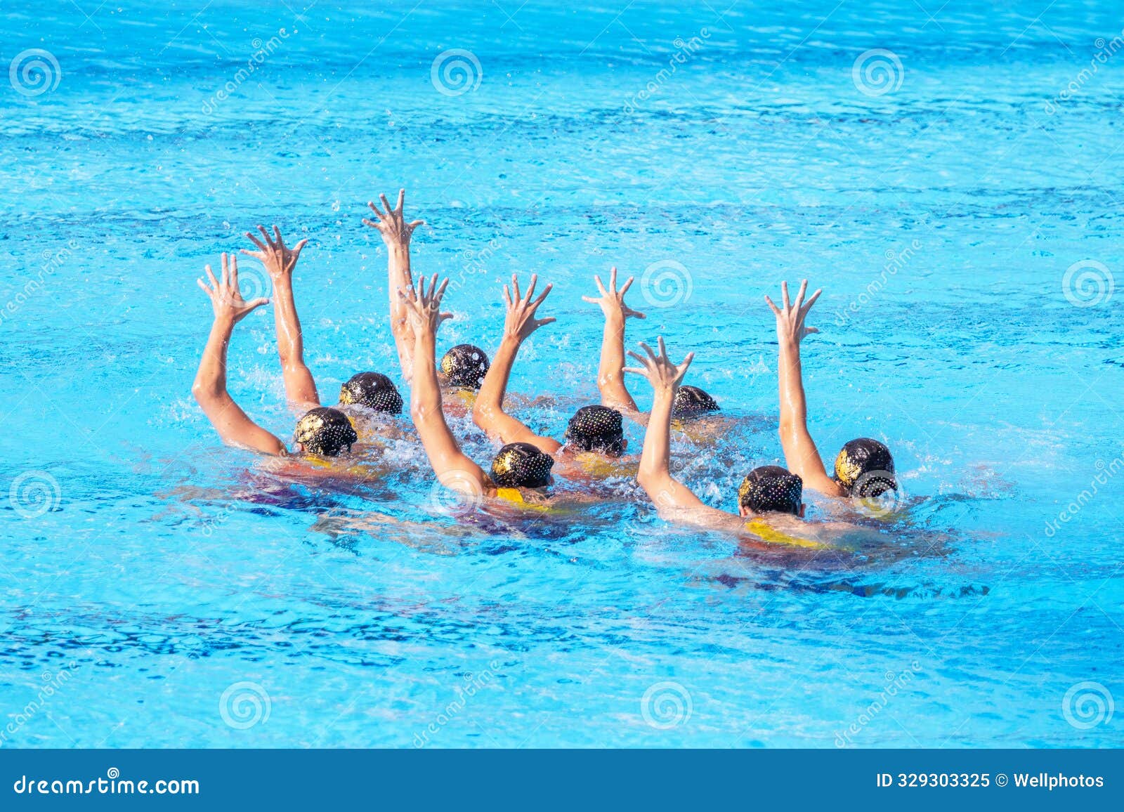 Artistic Swimming Team Performing Synchronized Choreographed Routine in ...
