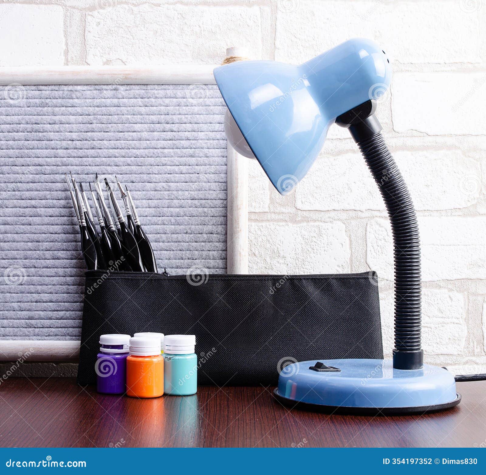Artistic Workspace with Lamp and Supplies Stock Photo - Image of purple ...