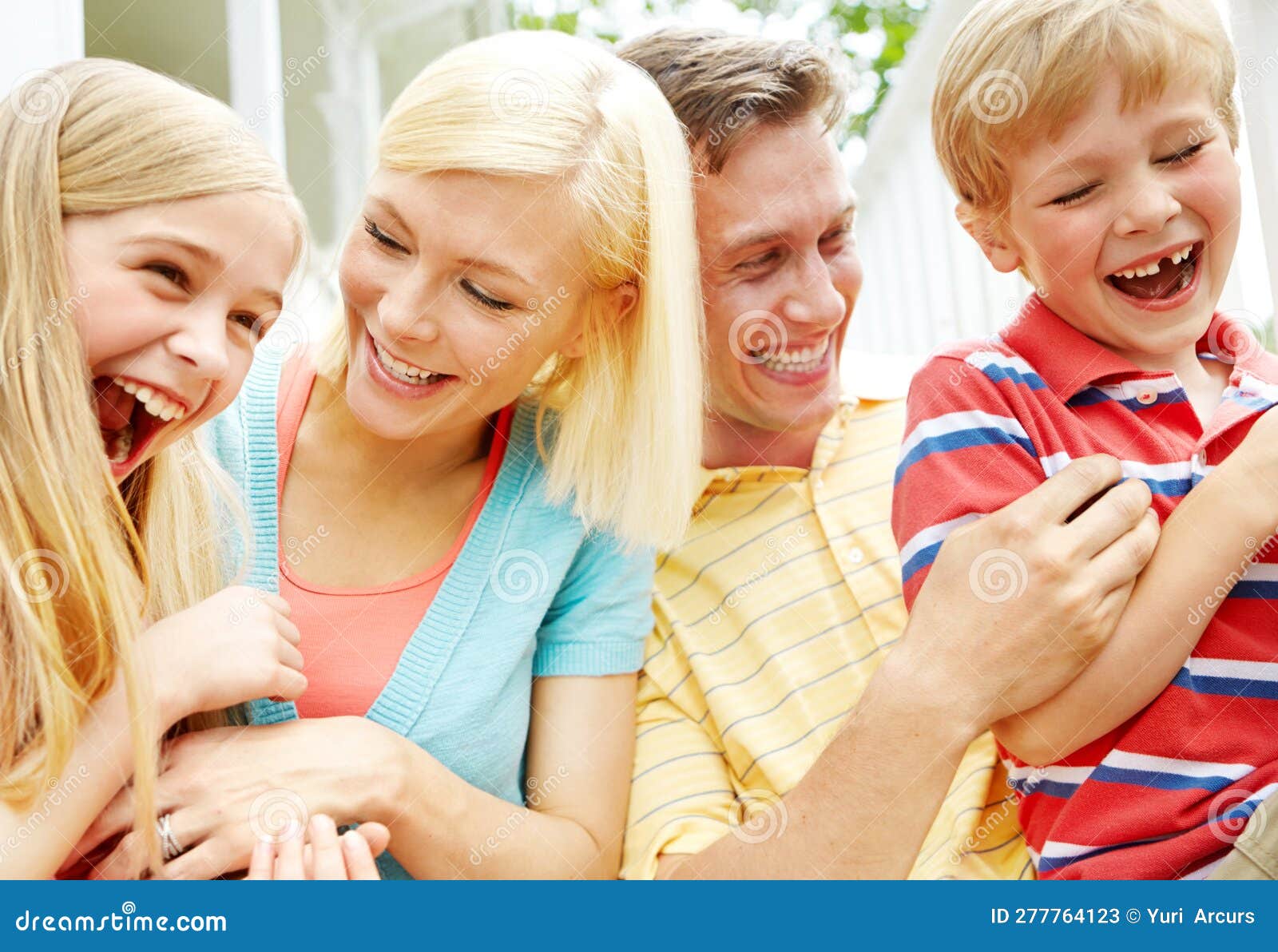 As Close As Family Can Be. a Young Family of Four Outside. Stock Image ...