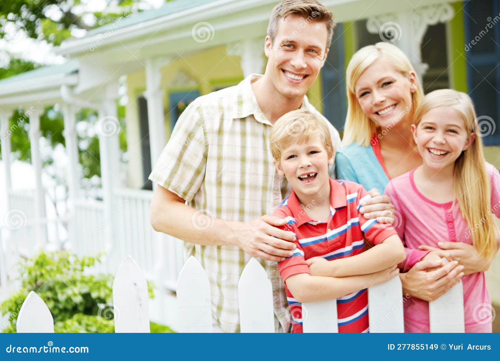 As Close As Family Can Be. a Young Family of Four Outside. Stock Image ...