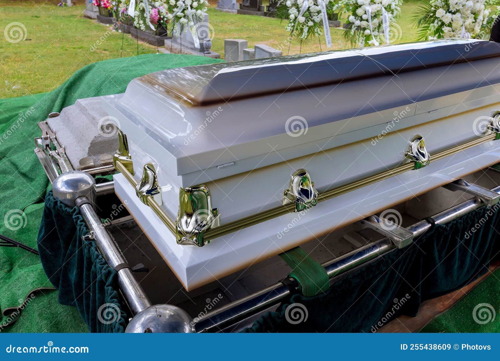 As Part of the Funeral Service in a Cemetery, the Coffin is Placed on ...