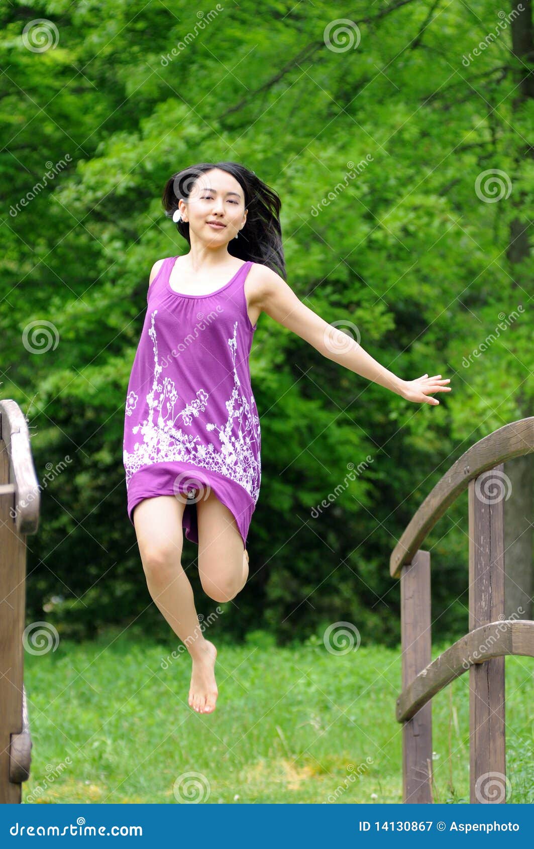 Asain Woman Jumping on Bridge Stock Image - Image of american, woods ...