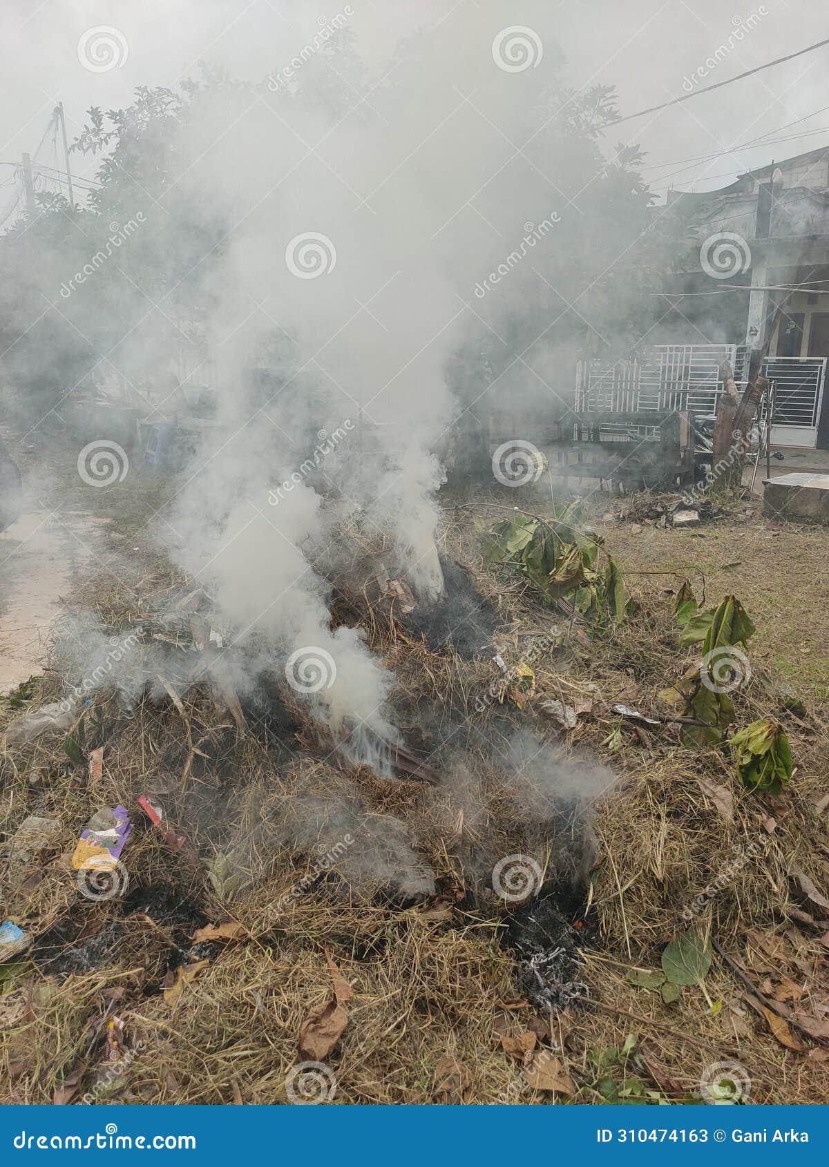 Smoke from burning rubbish stock image. Image of pembakaran - 310474163