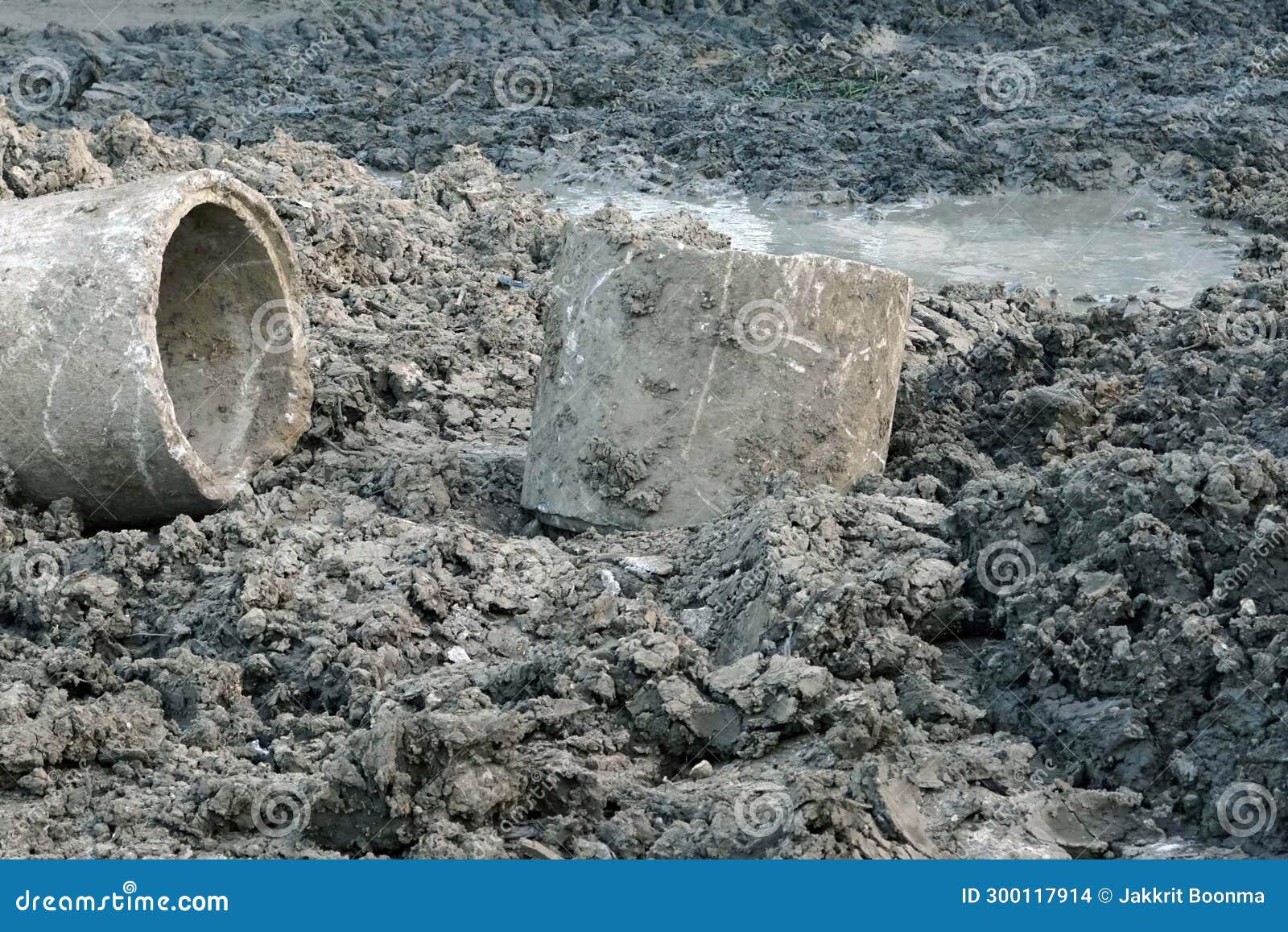 An Asbestos Cement Pipe in the Mud of a Construction Site Stock Photo ...