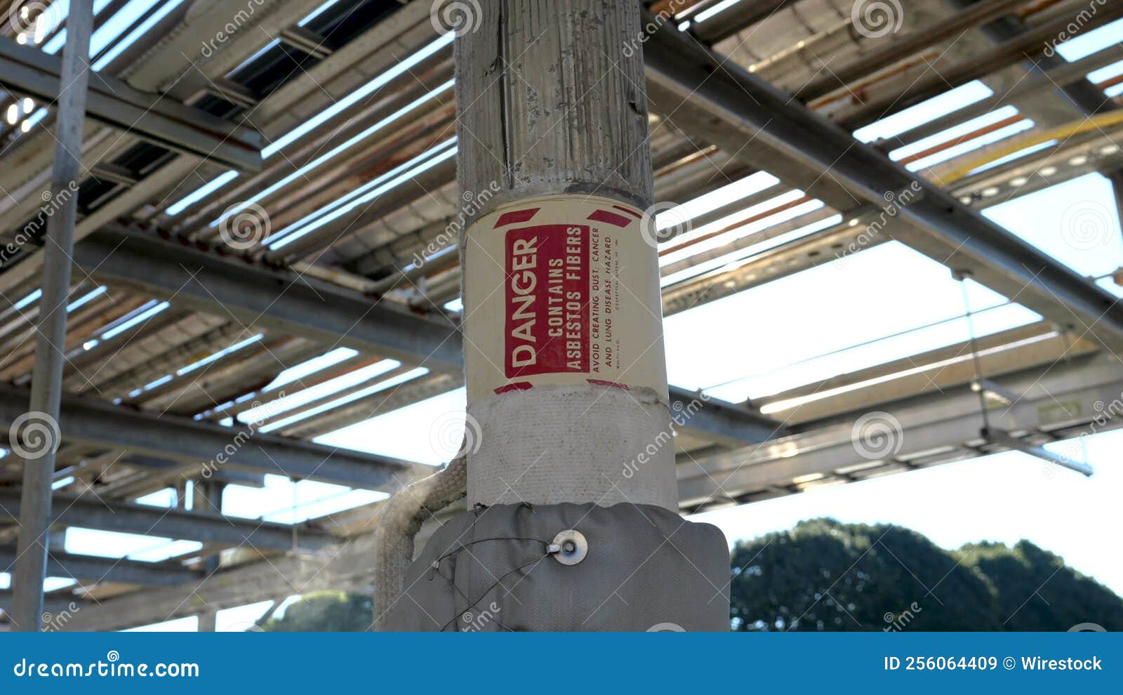 Asbestos Danger Sign on a Pipe in an Industrial Setting. Stock Video ...