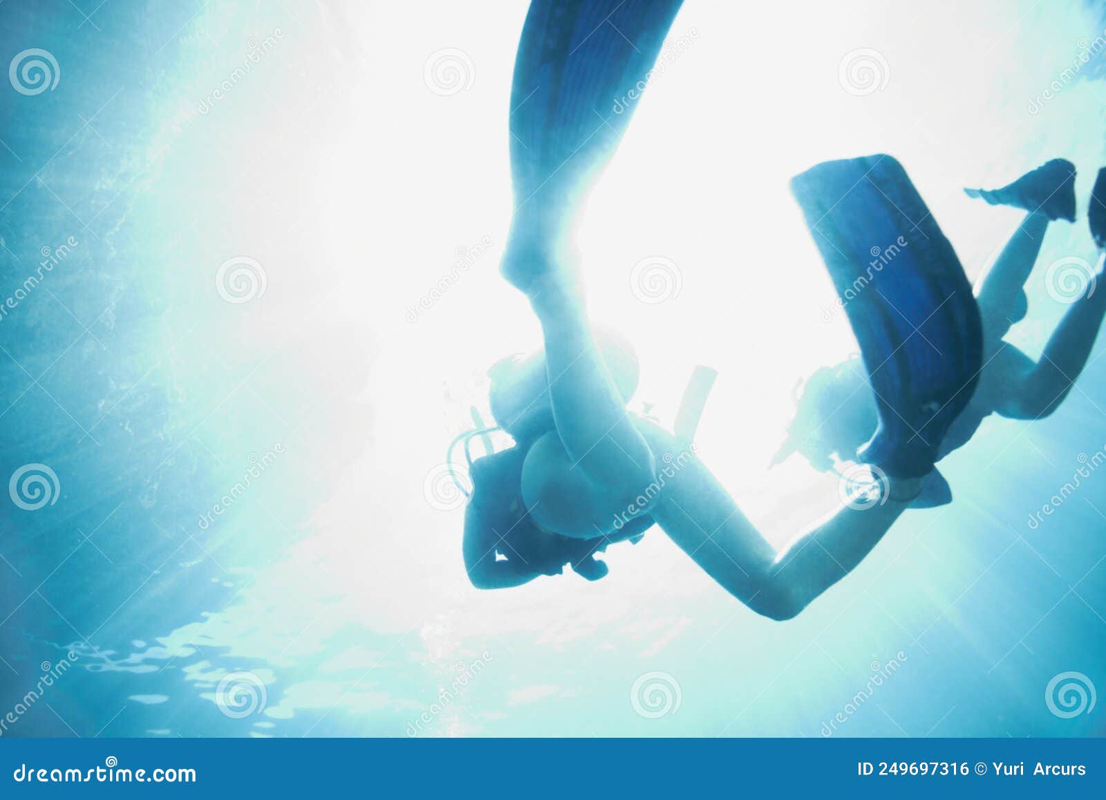 Ascending from the Deep. Bottom View of Two Scuba Divers As they Ascend ...