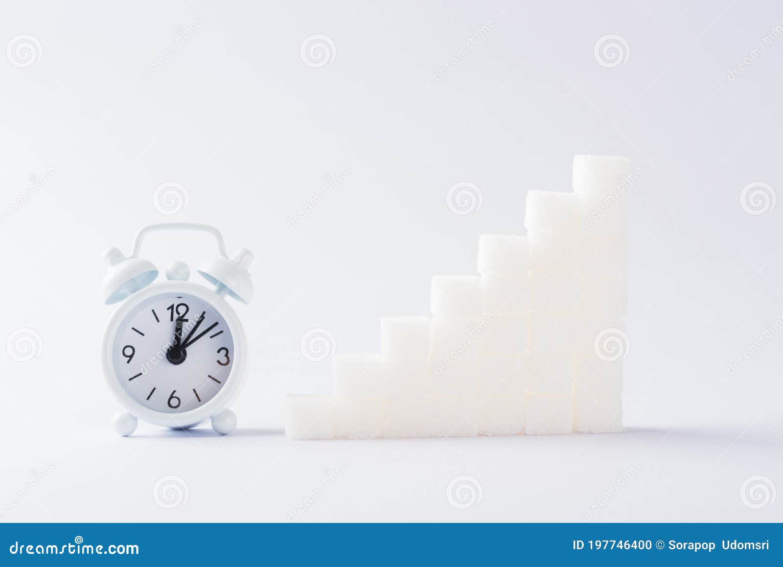Ascending Stacks of Sugar Cubes Graph Chart and Alarm Clock Stock Photo ...